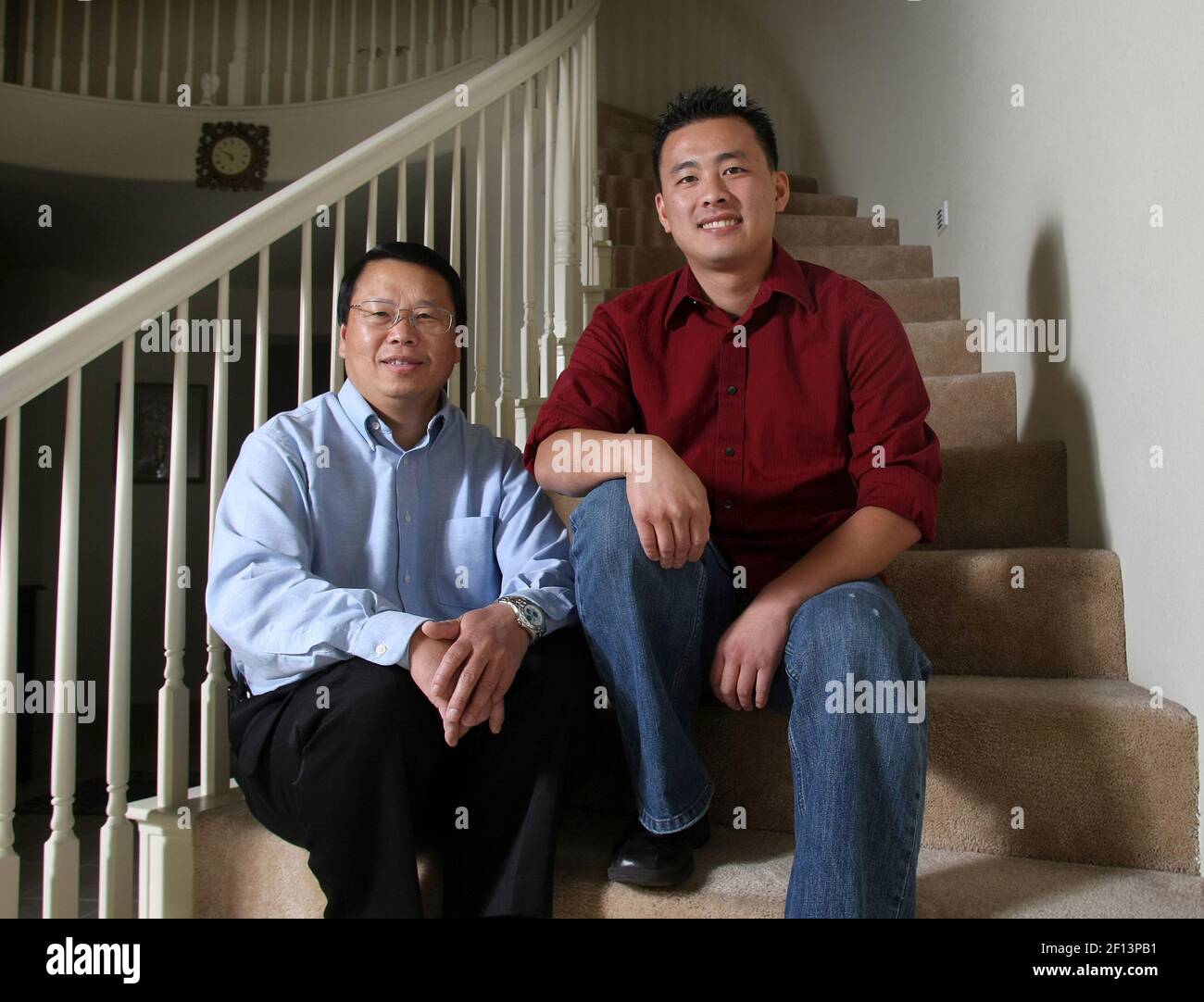 Tom Moua, left, and his son, John, are pictured in their Fresno ...
