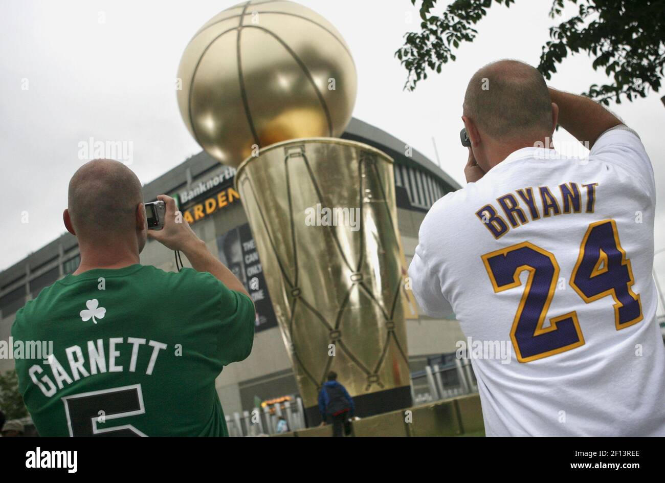 Fans snap a shot of an oversized trophy outside of the arena before the ...