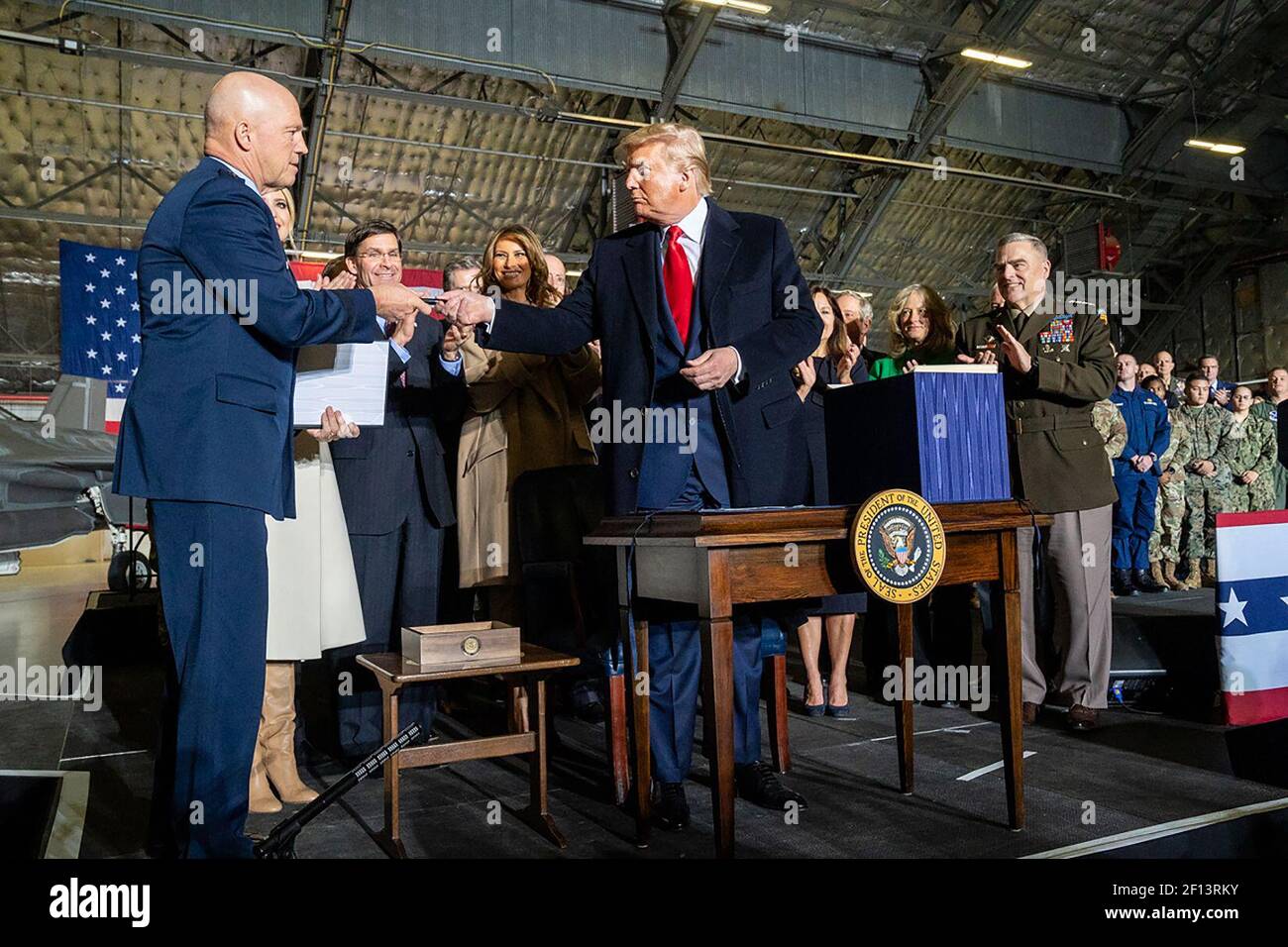 President Donald Trump greets Gen. Jay Raymond after being named the ...