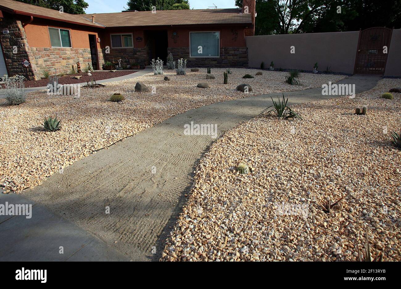 Louis Almaraz and his wife Debra took out the lawn in their front yard ...