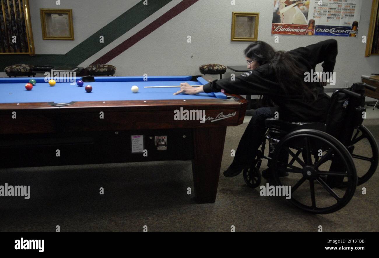 Noel Campos, 30, lines up her shot as she practices 8-ball at Diamond ...
