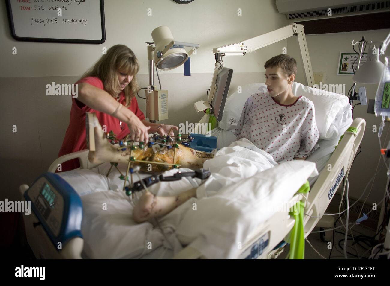Lynn Beck assists her son, N.C. National Guardsman Michael Beck, who ...