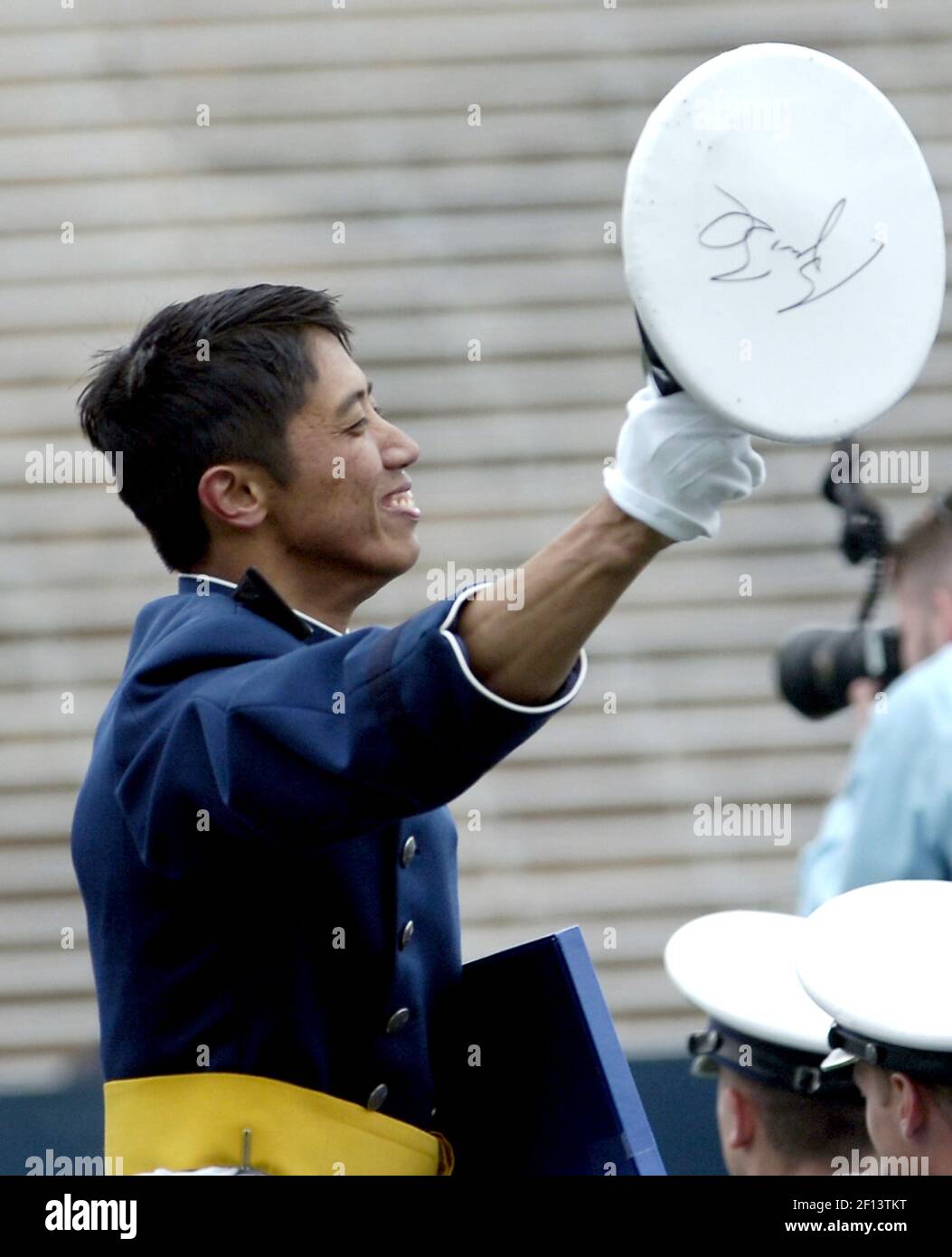 Mario Cabral Mendoza Jr., of the Philippines, shows off his hat after ...