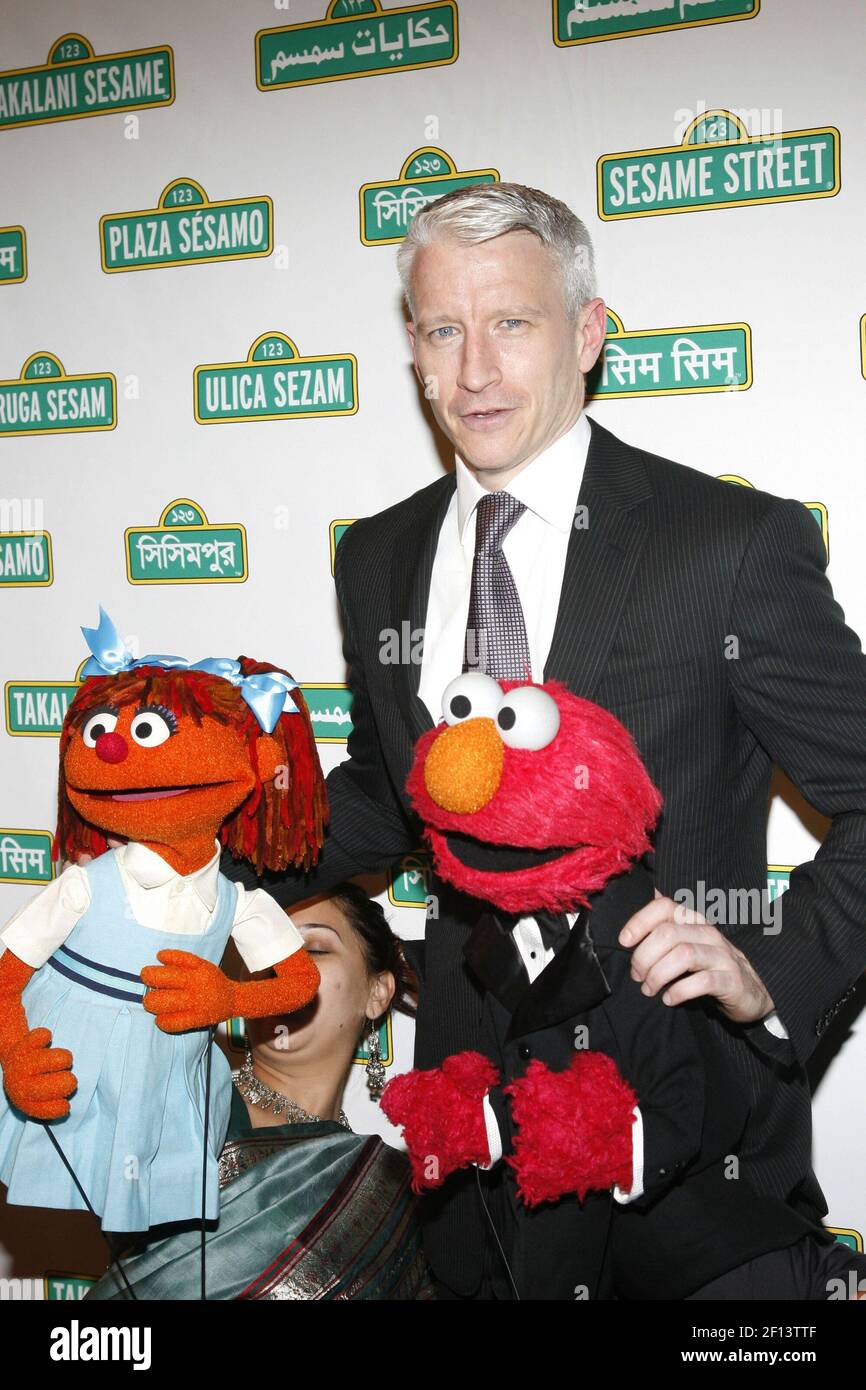CNN news anchor Anderson Cooper poses with Elmo and Leela, of Sesame ...