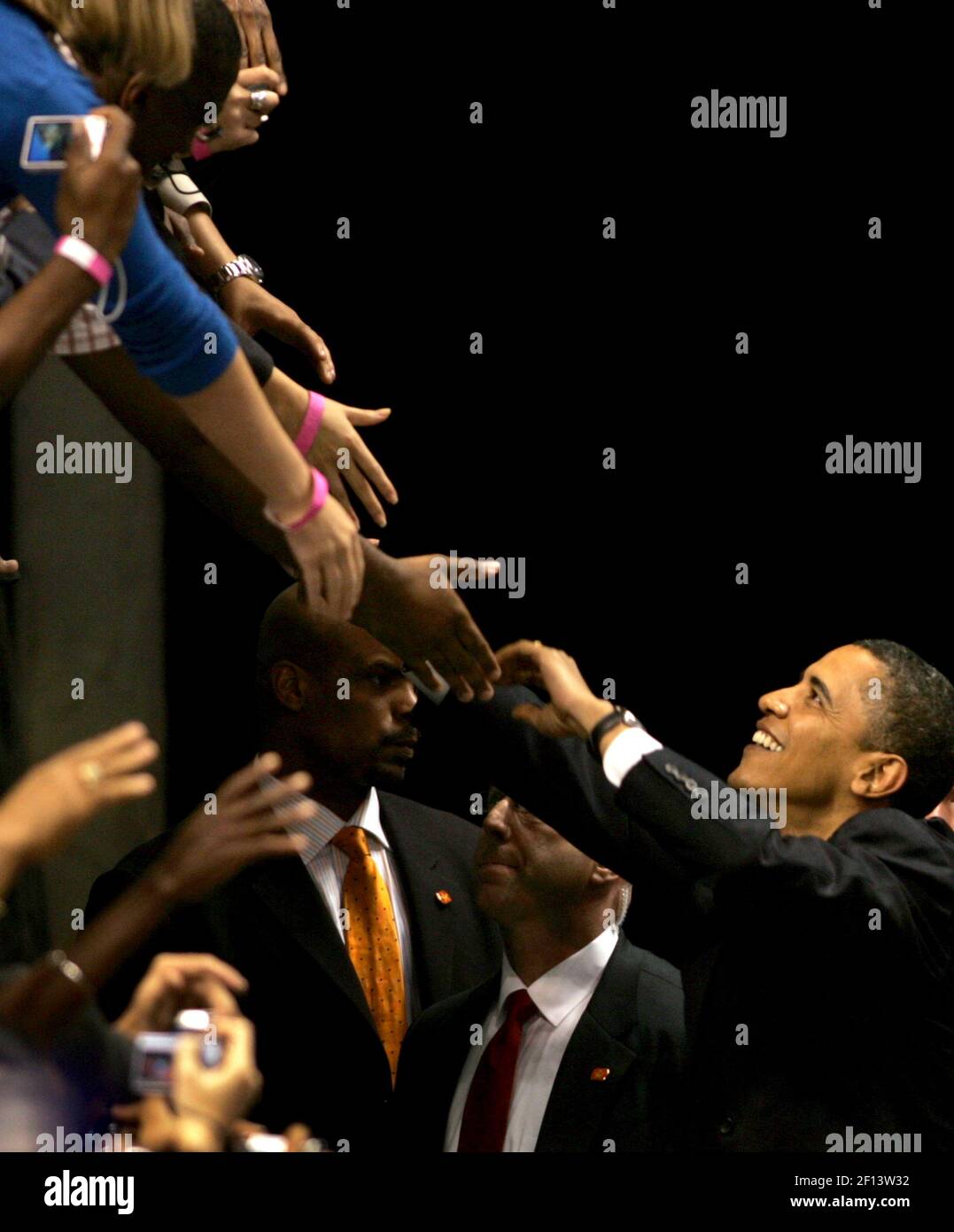 Supporters reach out to shake the hand of Democratic presidential ...