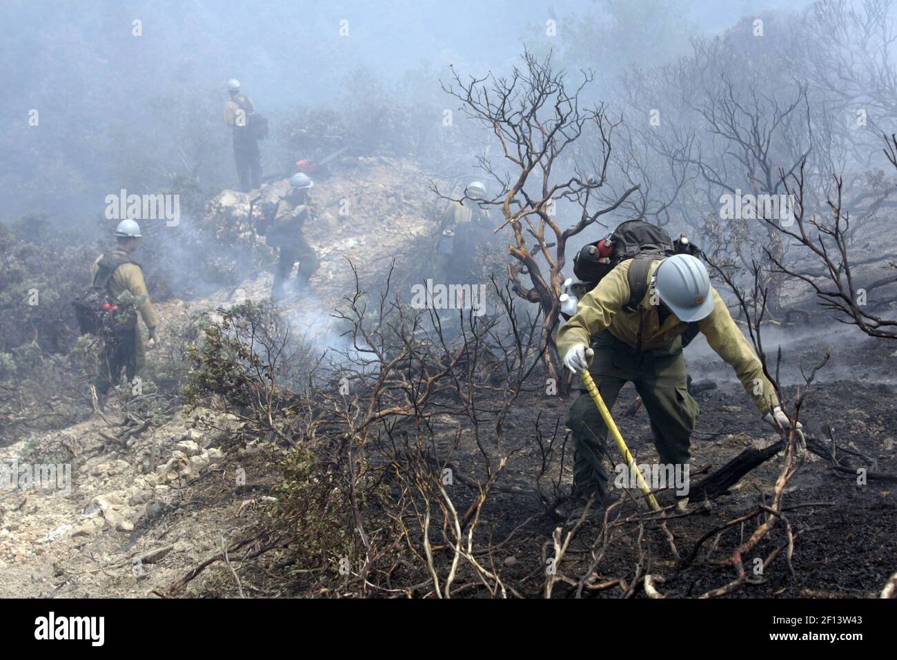 Forest Service Hot-Shot Fire Fighter Andrew Kenner works the fire line ...
