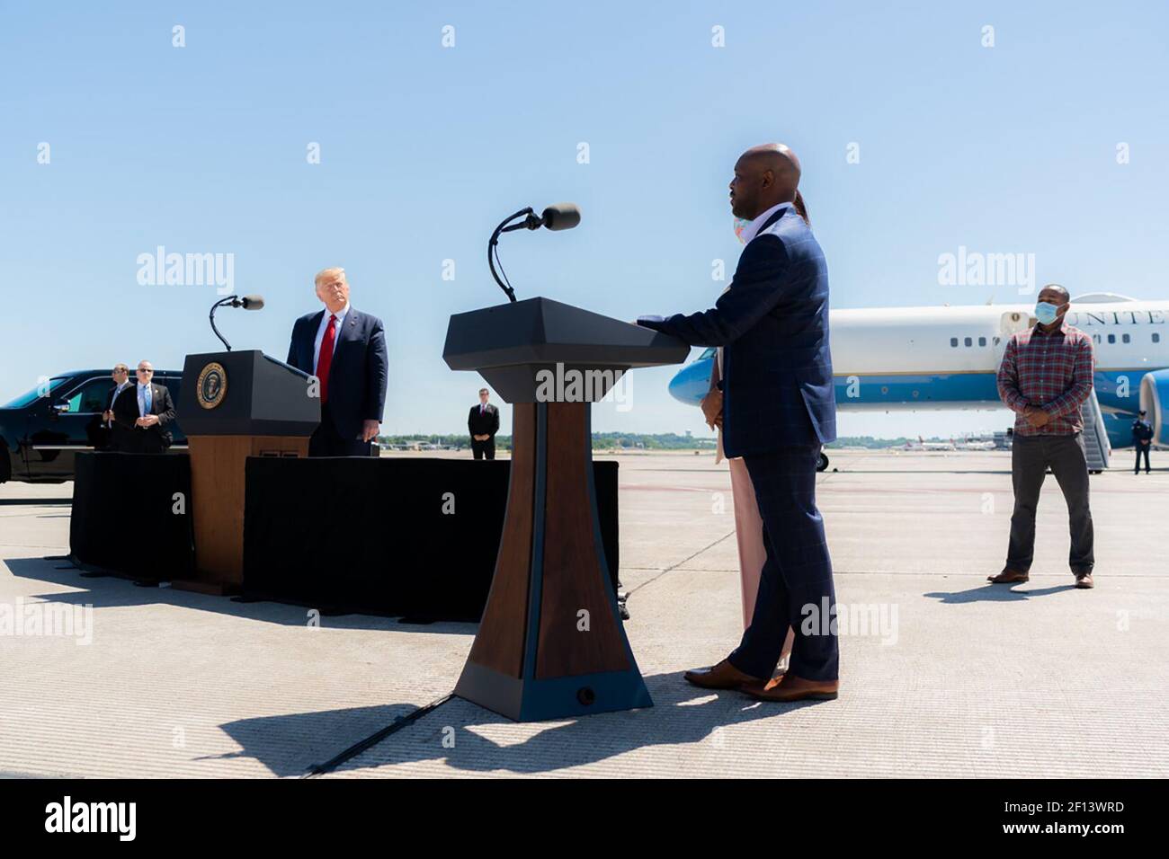 President Donald Trump listens as fireman and small businessman K.B ...