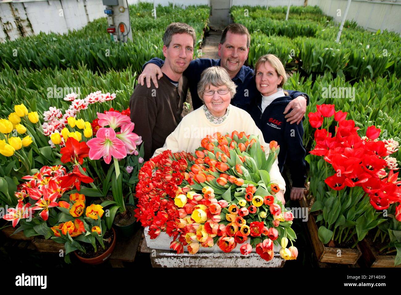 The Possehl family including Cathy Possehl, center, stands in tulip ...