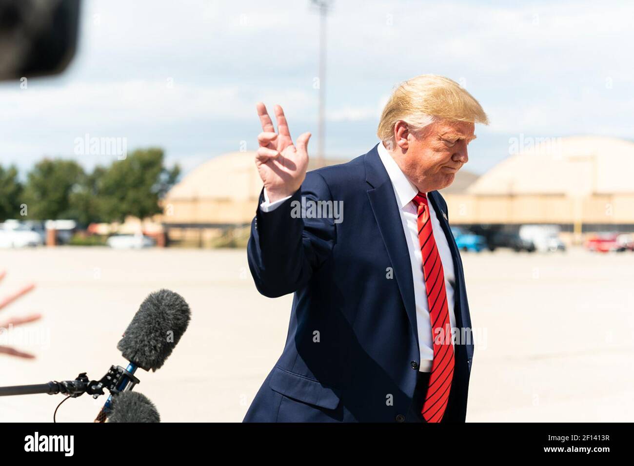 President Donald Trump speaks with reporters after disembarking Air ...