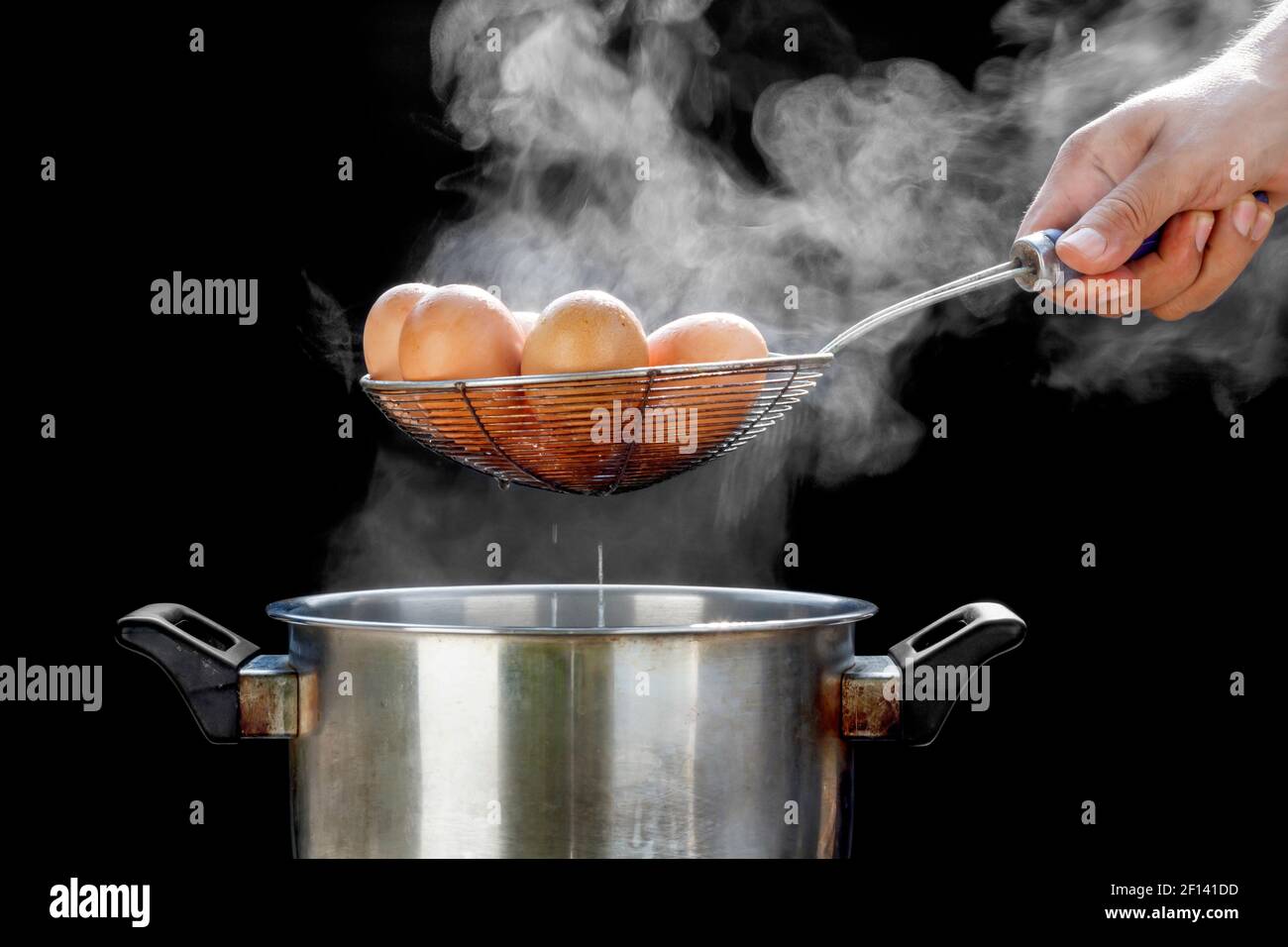 Two eggs in boiling water hi-res stock photography and images - Alamy