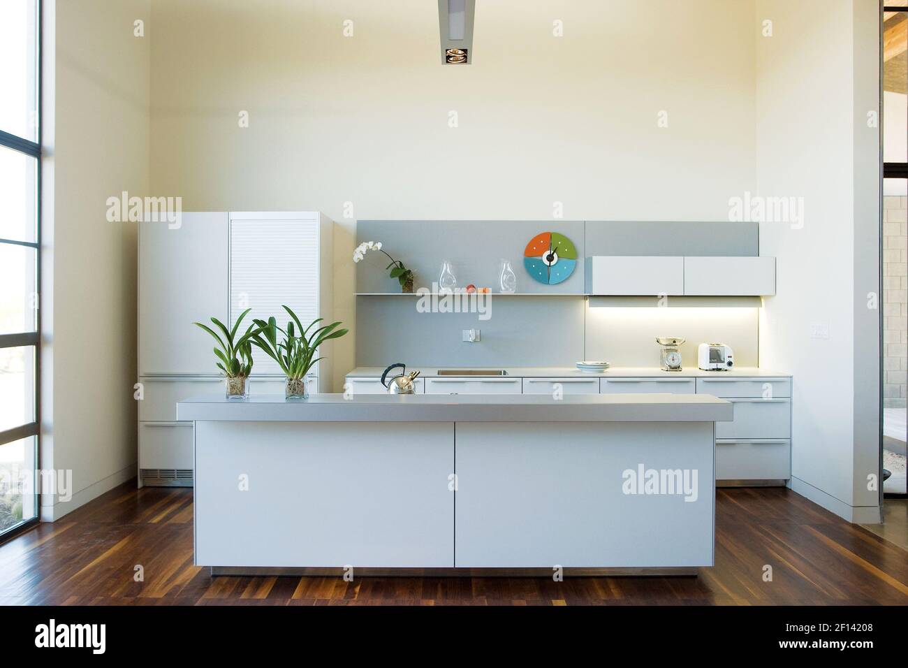 The Bulthaup kitchen features expanses of white and bluish-gray ...