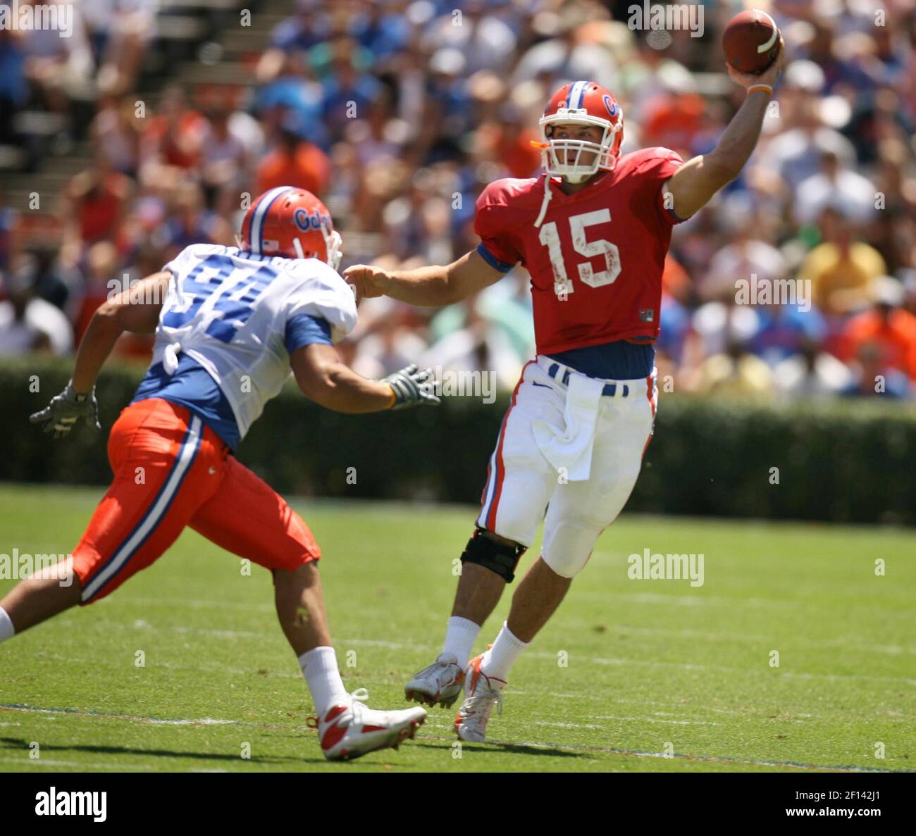 Florida quarterback Tim Tebow throws over defensive end Justin Trattou ...