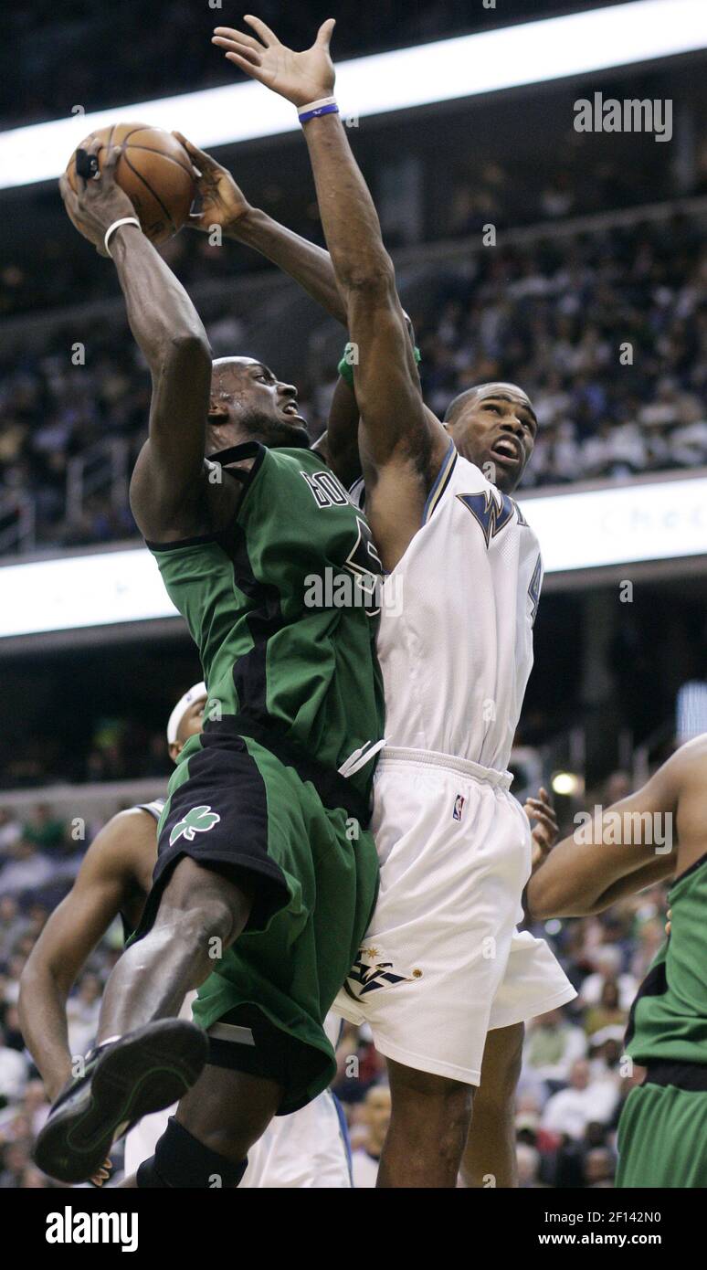 The Boston Celtics' Kevin Garnett (left) attempts a shot as the ...