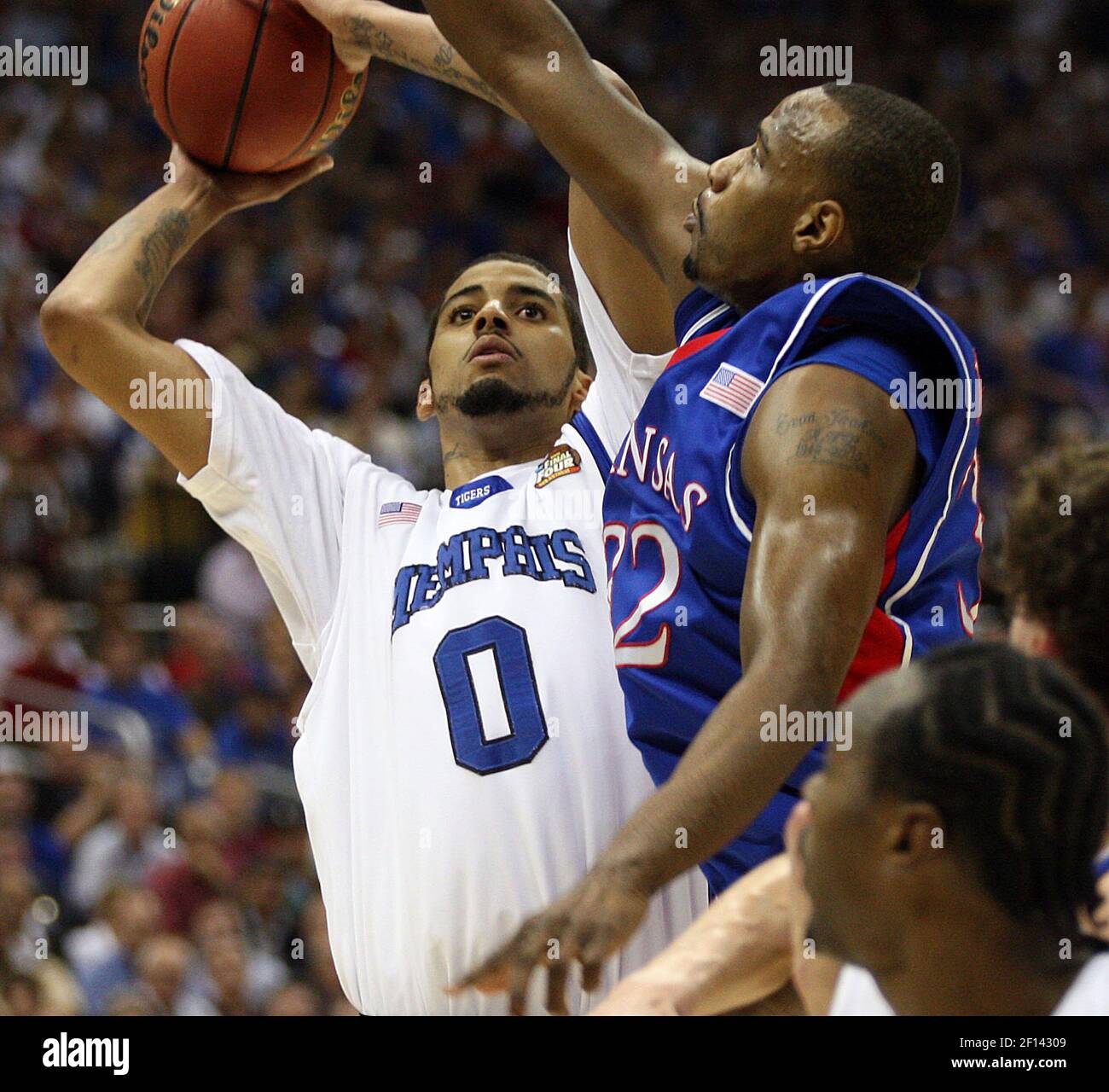 Memphis' Shawn Taggart (0) puts up a shot against Kansas' Darnell ...