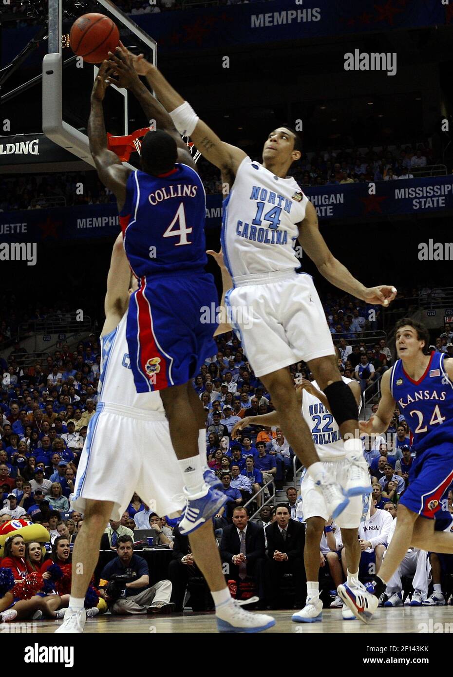 North Carolina's Tyrel Reed (14) gets a hand on the shot of Kansas ...