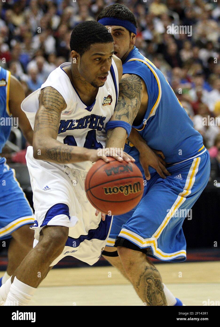 Memphis' Chris Douglas-Roberts (14) attempts to drive past UCLA's ...