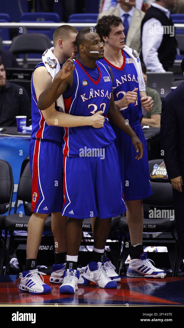Kansas' Cole Aldrich (45), Darnell Jackson (32) and Sasha Kaun (24 ...