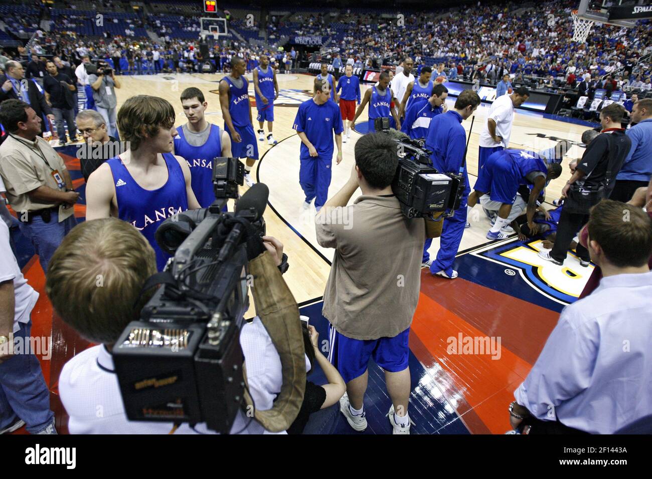 Kansas guard Rodrick Stewart, far right, is attended to as the team ...