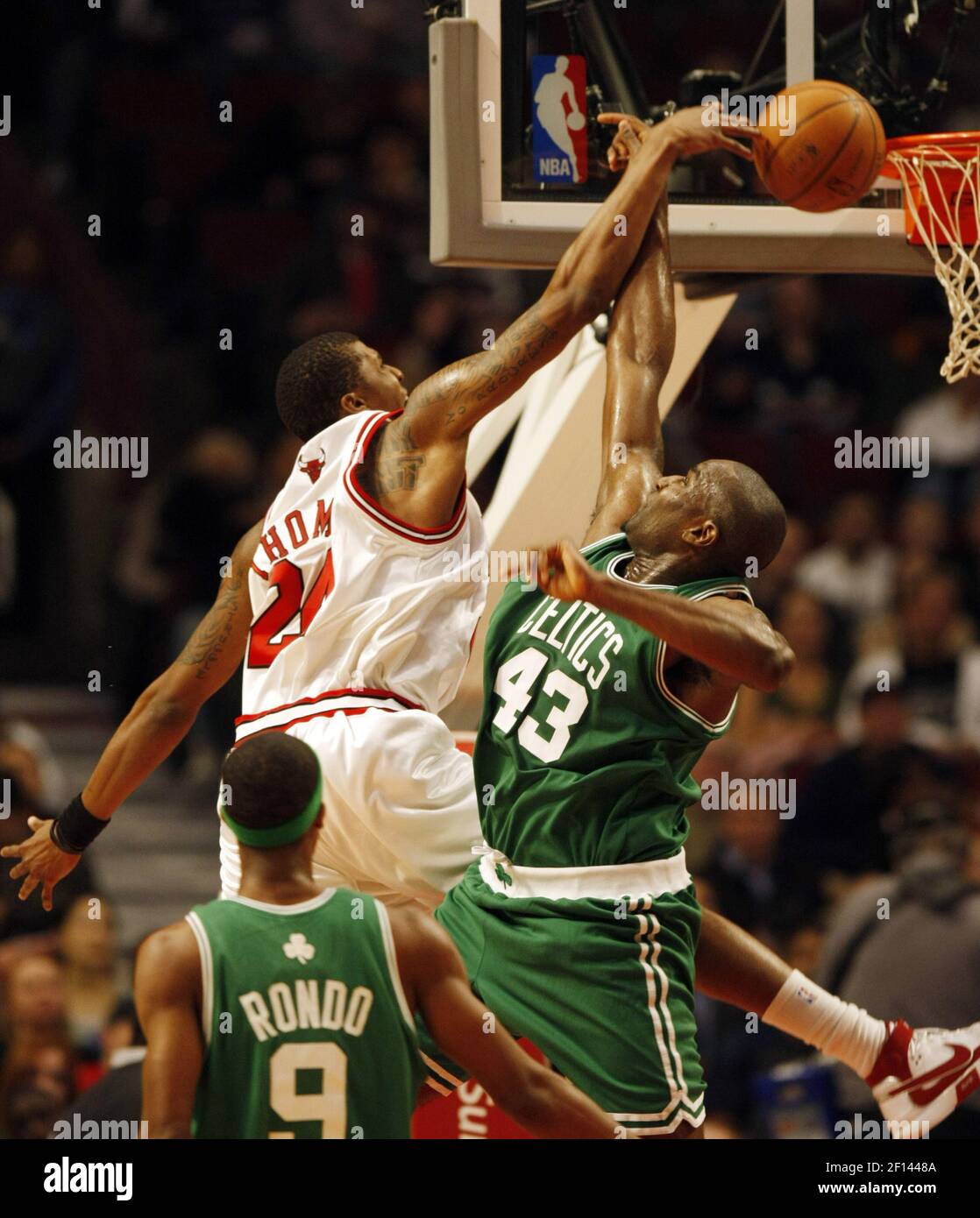 The Chicago Bulls' Tyrus Thomas (left) runs into a block by the Boston ...