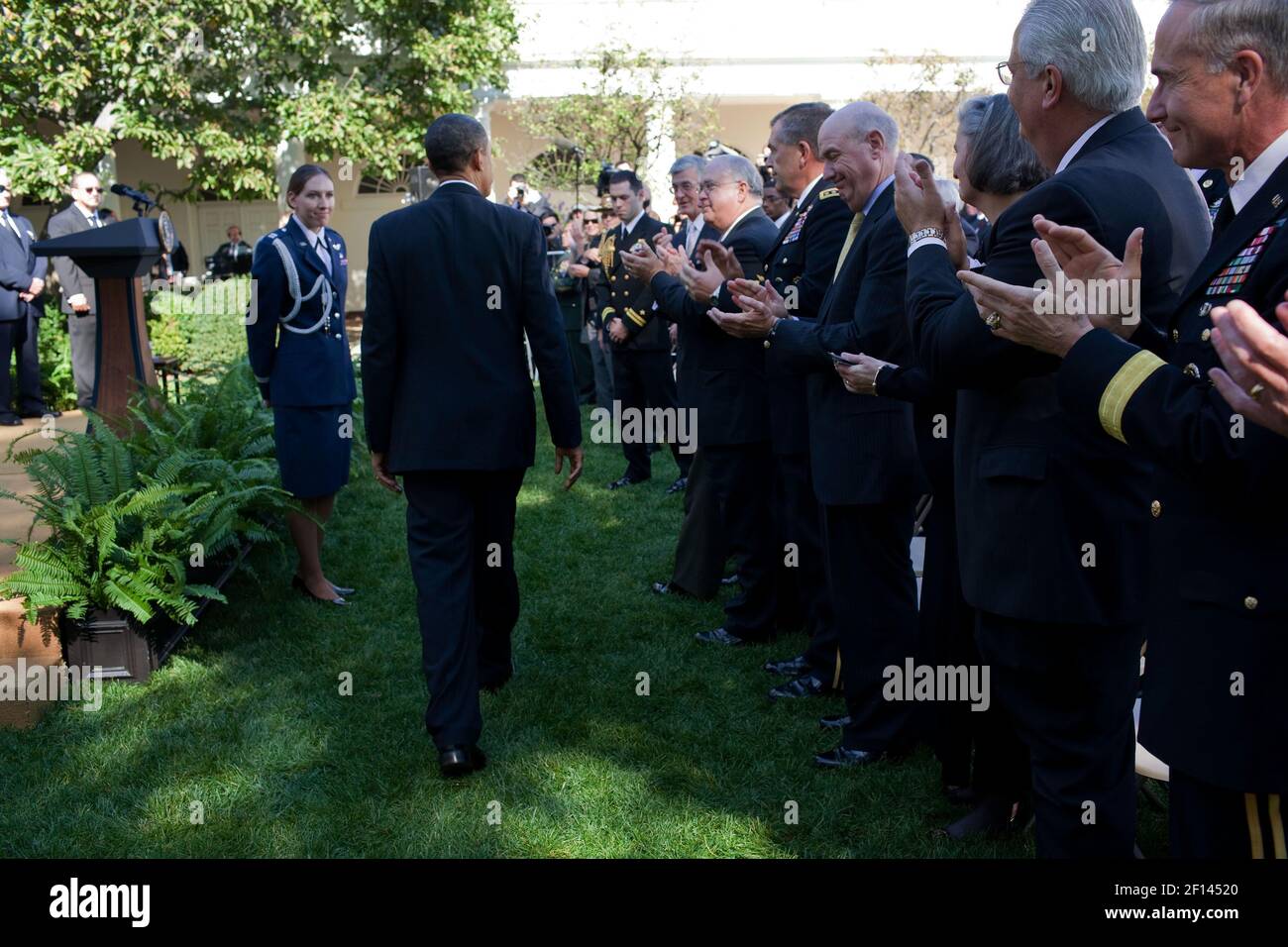 Veterans applaud President Barack Obama as he departs the recognition ...