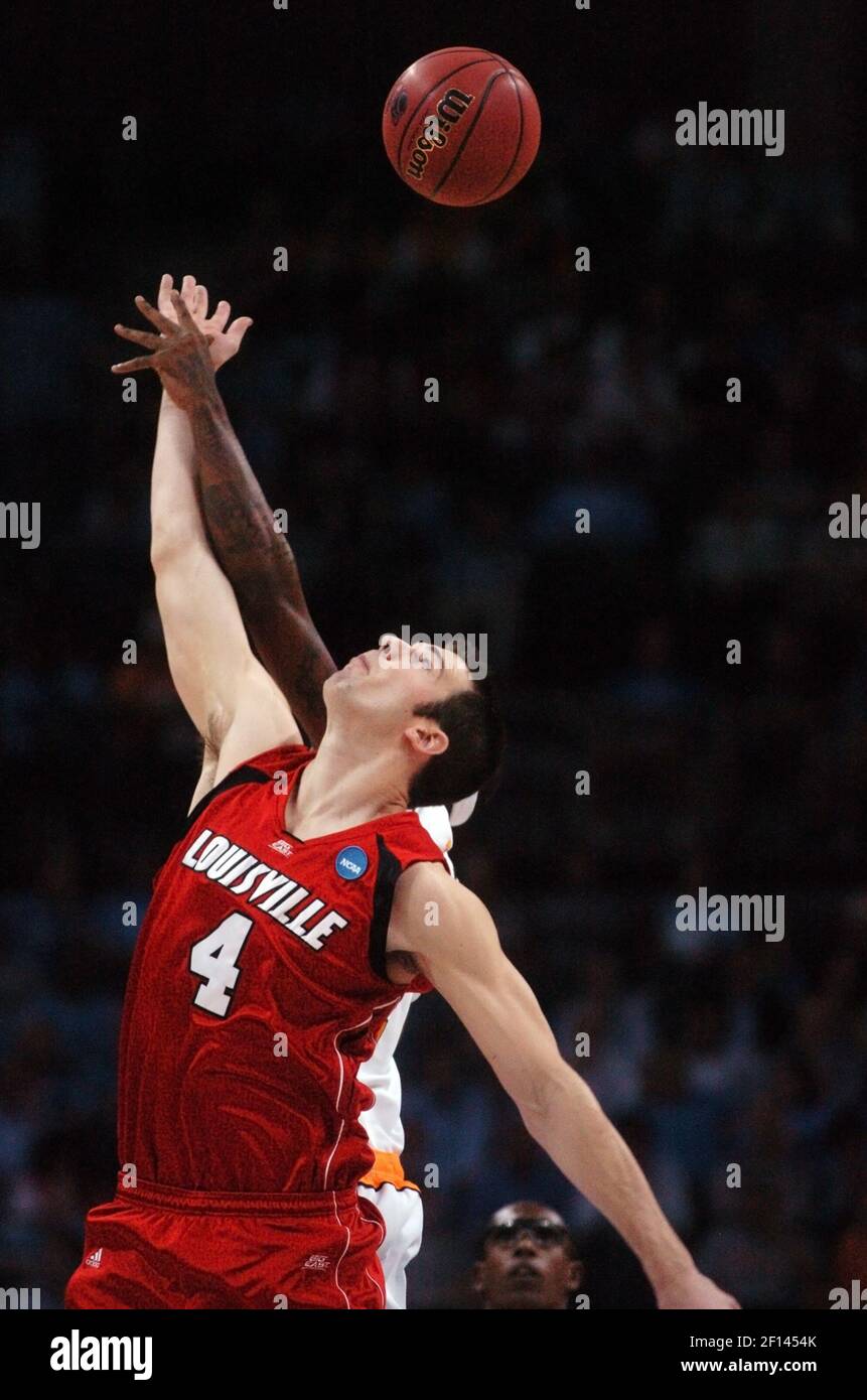Louisville's David Padgett (4) and Tennessee's Tyler Smith (1) jump for ...