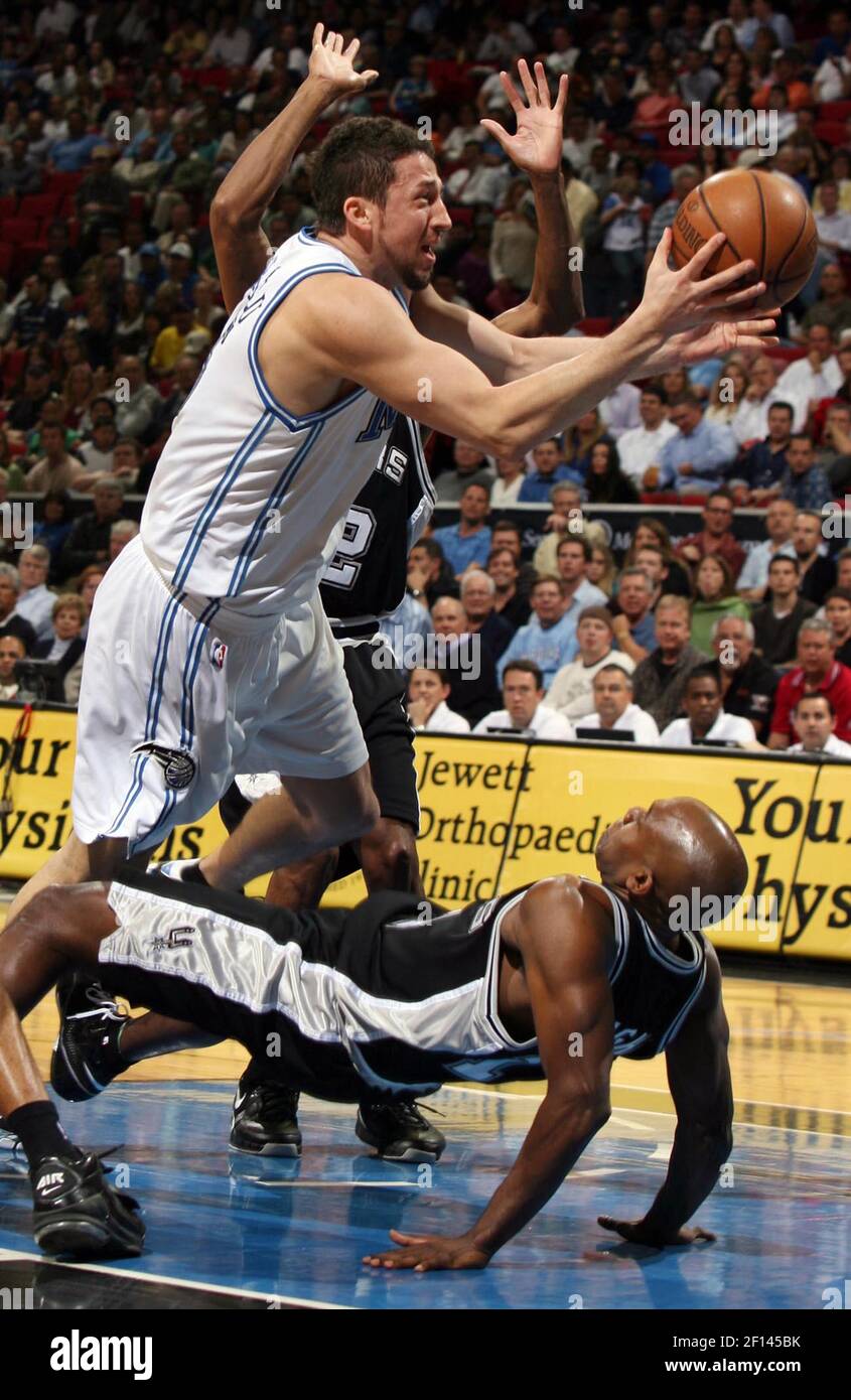 Orlando Magic forward Hedo Turkoglu knocks down San Antonio Spurs guard ...