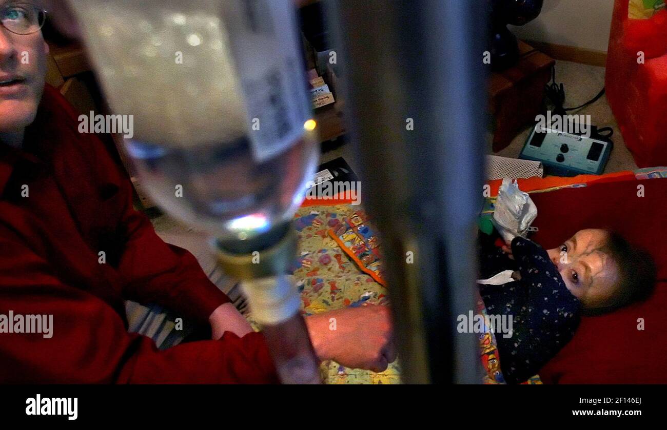 Tom Kimlinger monitored an IV as he administered medicine to boost his ...