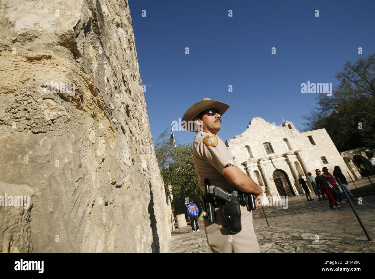 Andrew Rangel of the Alamo Rangers security force stands guard at The ...