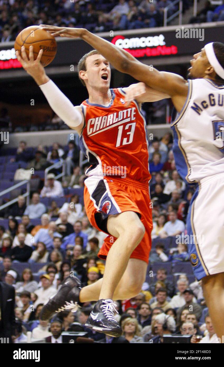 The Charlotte Bobcats' Matt Carroll (13) drives to the baske as the ...