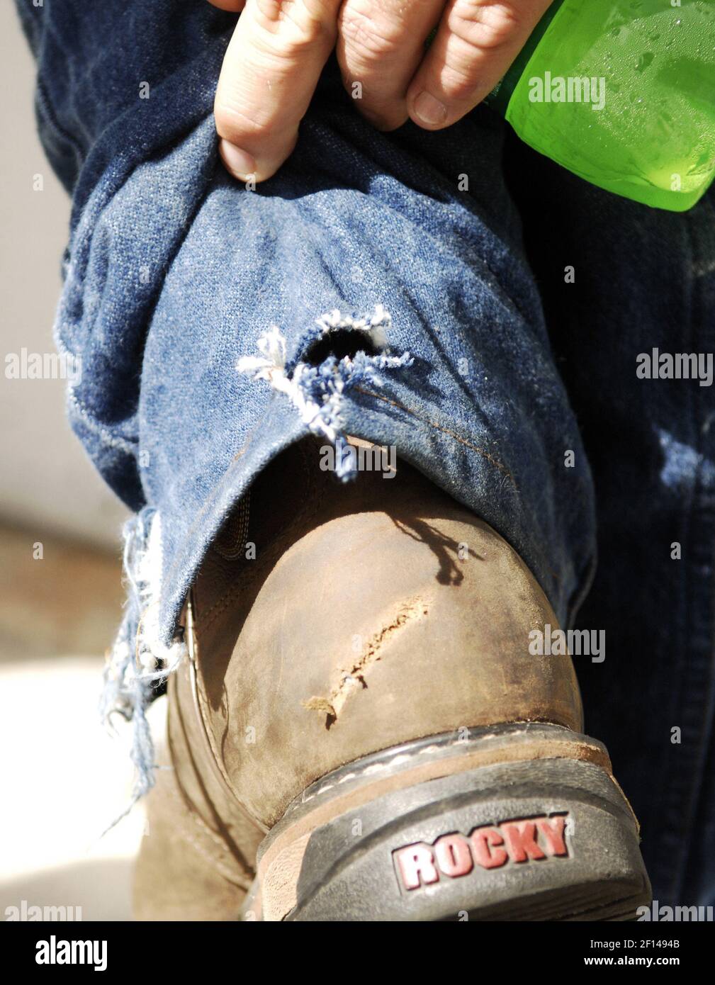 Josh Maynard, 30, shows where a bullet graze his boot during a shooting ...