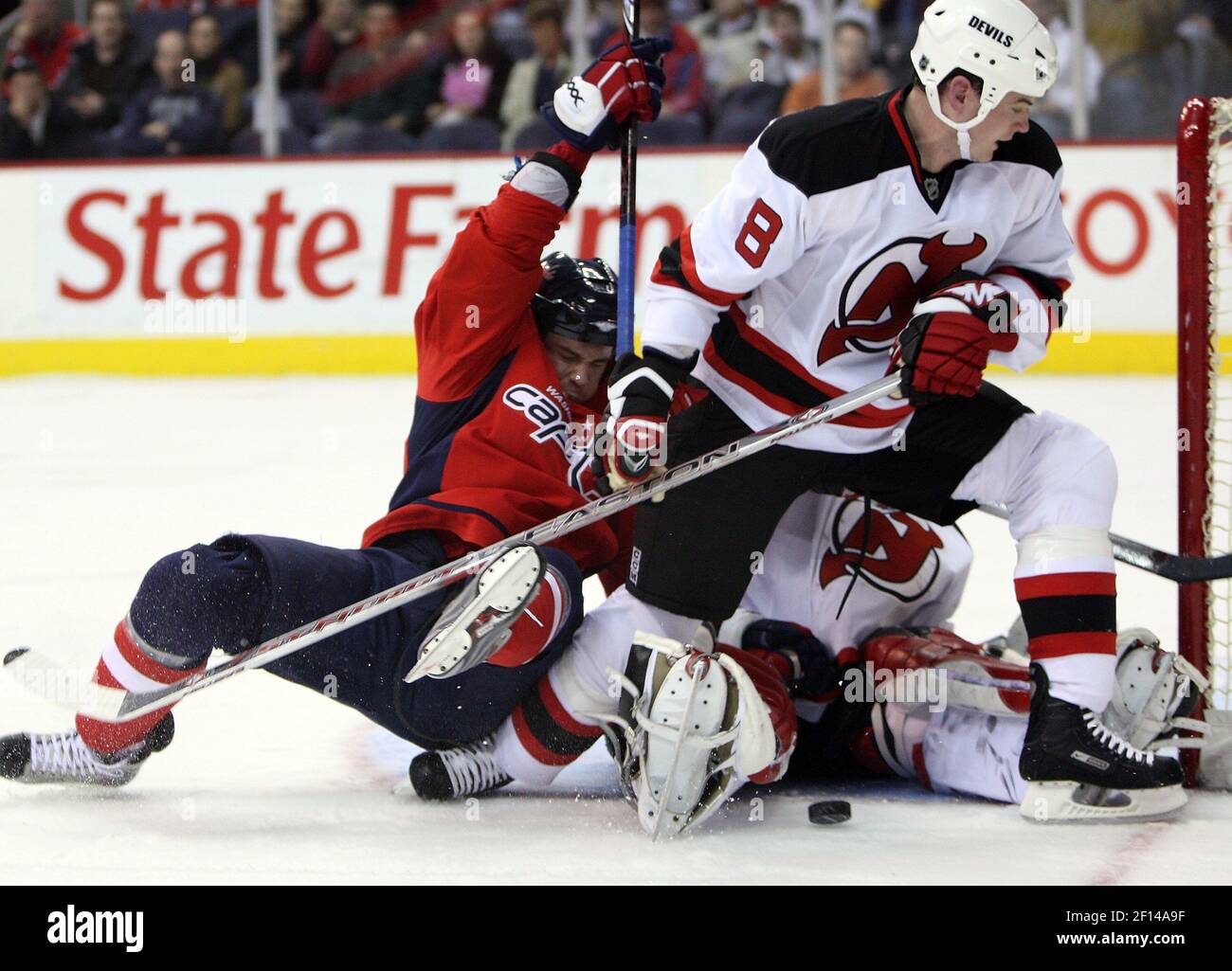 The Washington Capitals' Matt Bradley, left, collides with New Jersey ...