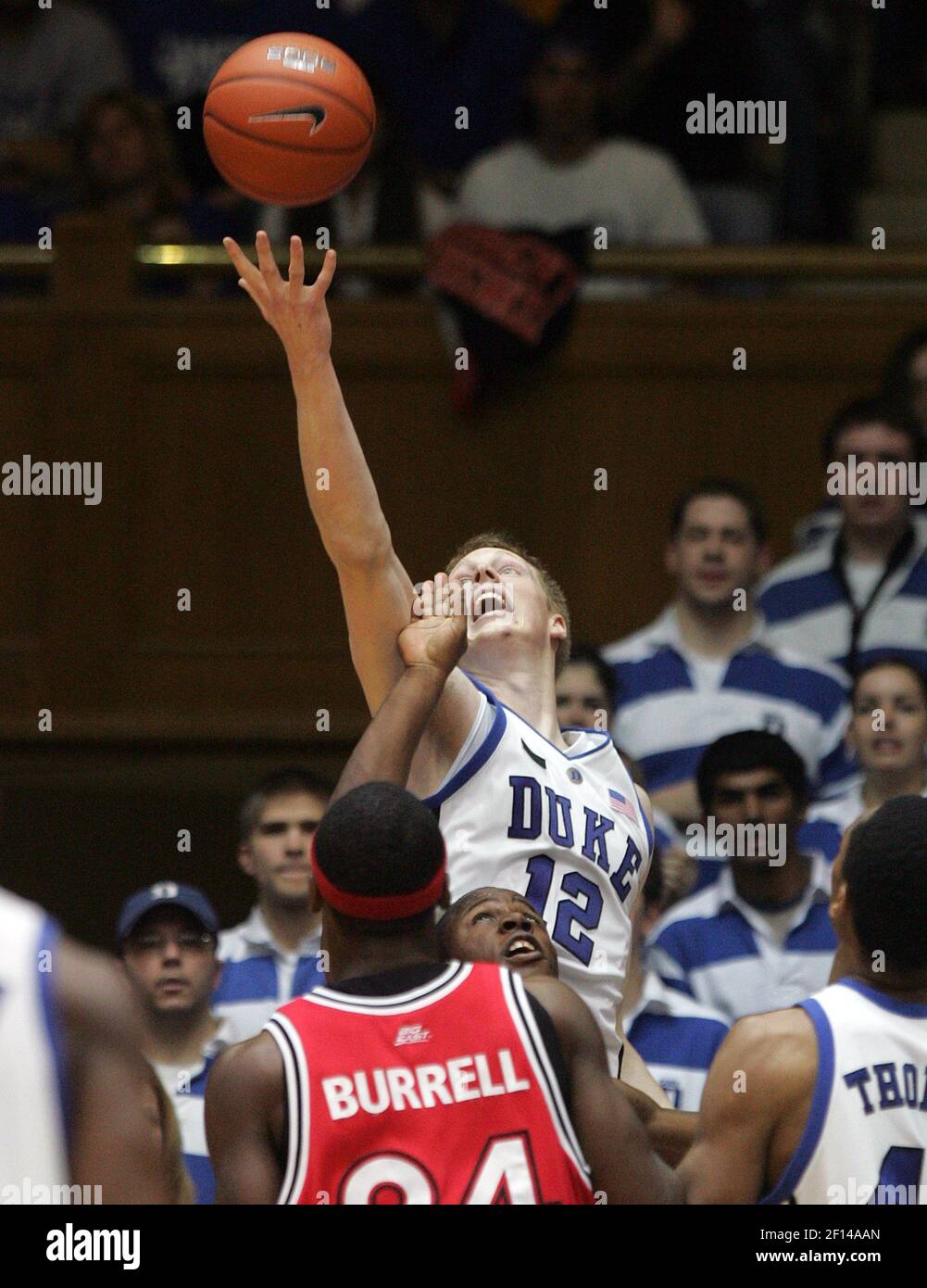 Duke's Kyle Singler (12) gets a rebound above St. John's Malik Boothe ...
