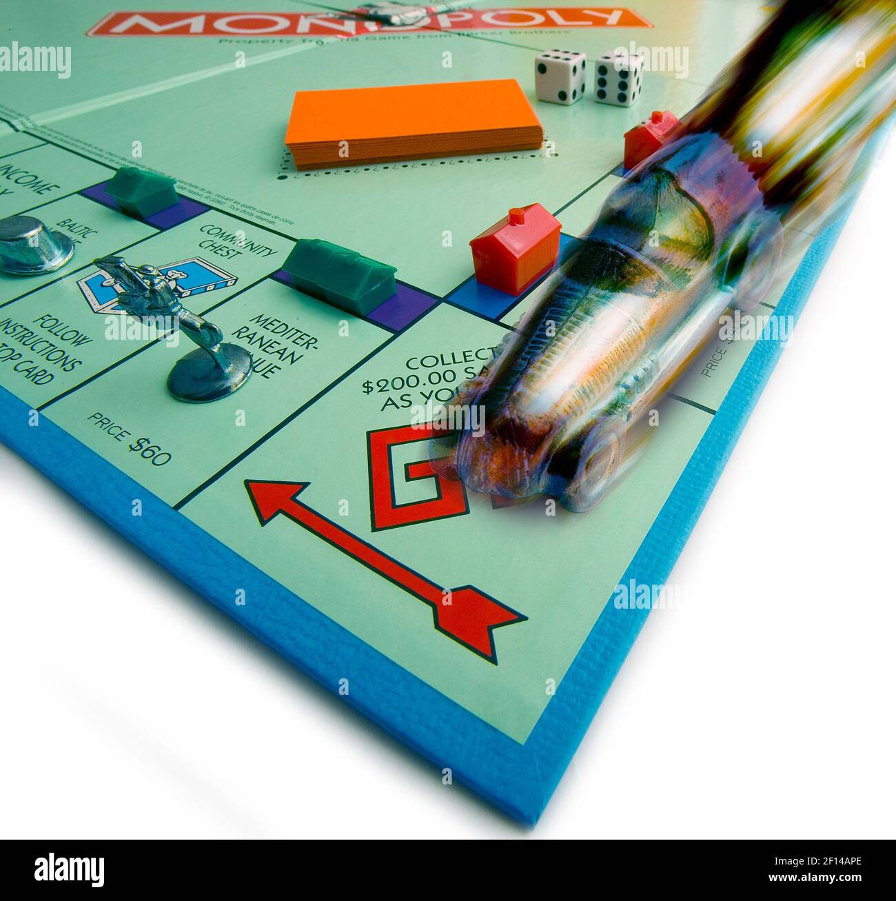 In this photograph, the racecar marker zooms around the Monopoly board ...