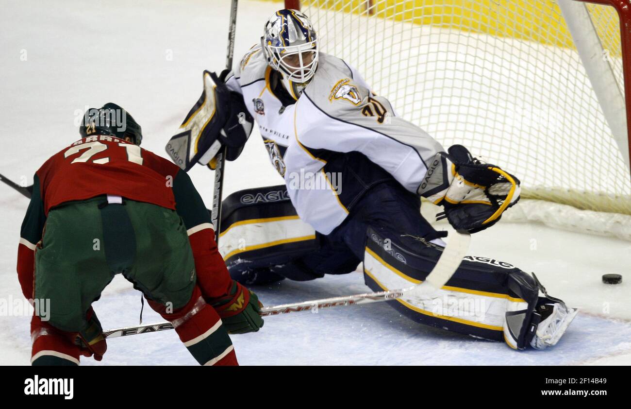 The Minnesota Wild's Mike Parrish (left) scores against Nashville ...