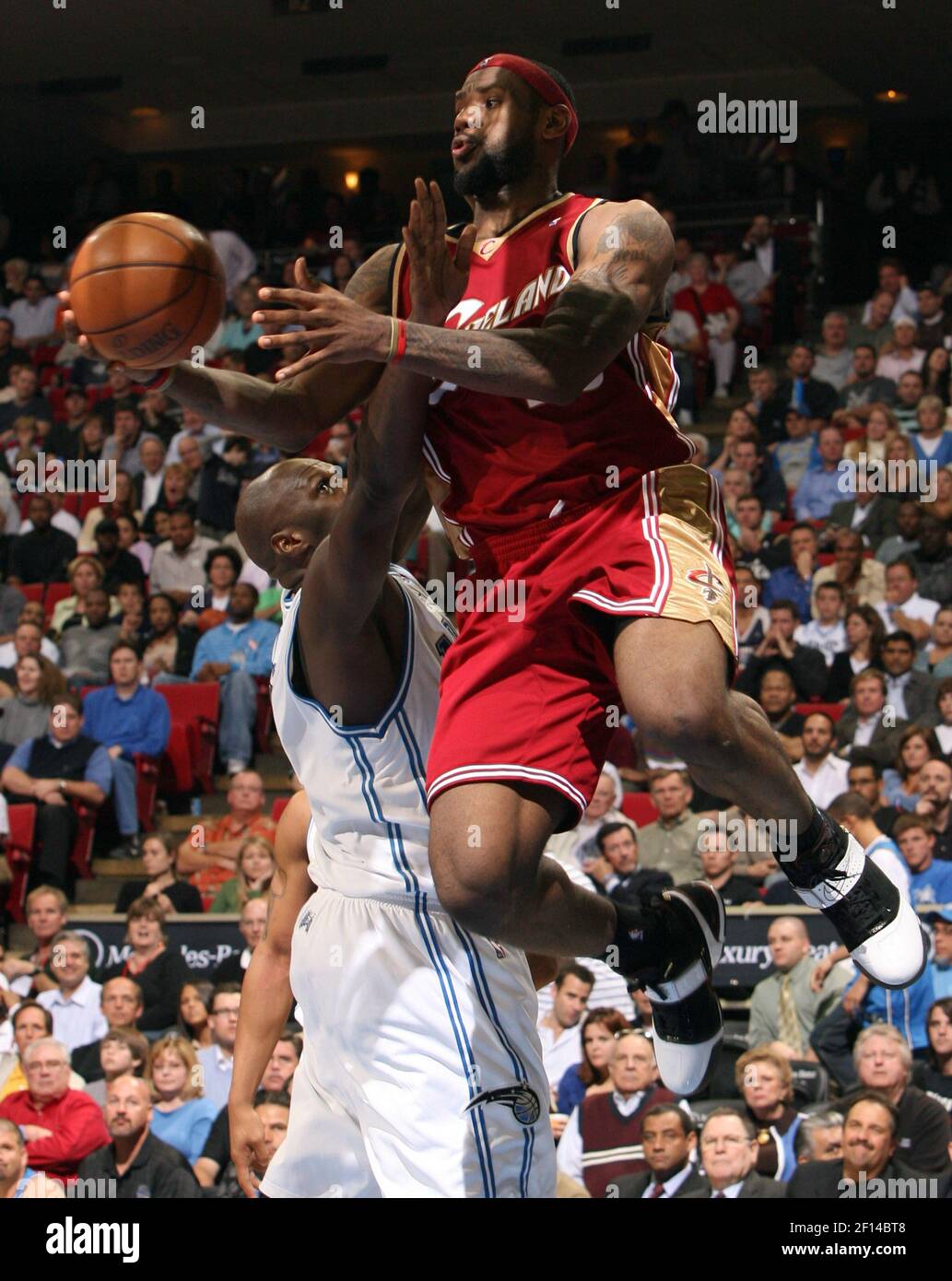 The Cleveland Cavaliers' LeBron James (23) draws the foul from the ...