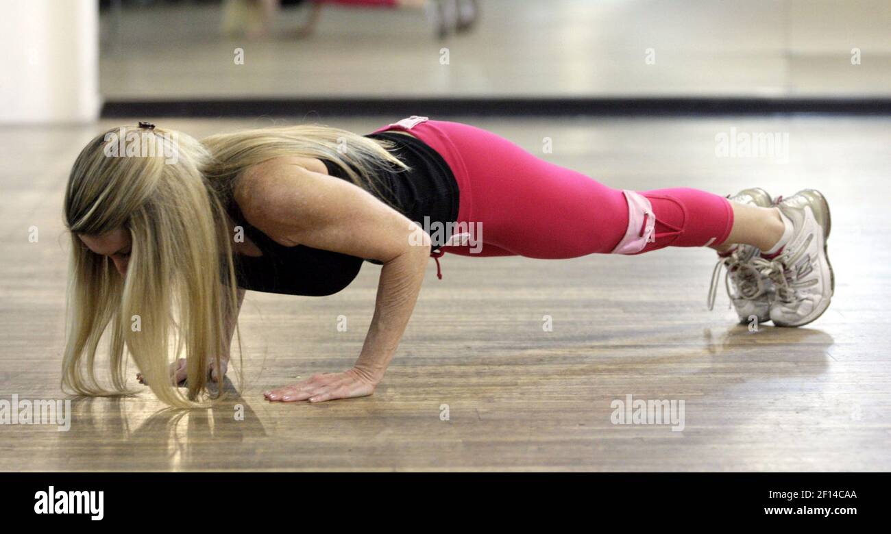 Fitness instructor Nancy Cole demonstrates the triceps push-up. (Photo ...