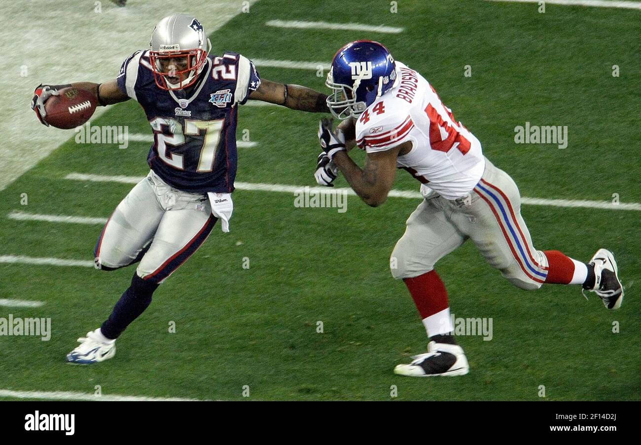 The New England Patriots' Ellis Hobbs (27) returns an interception and ...