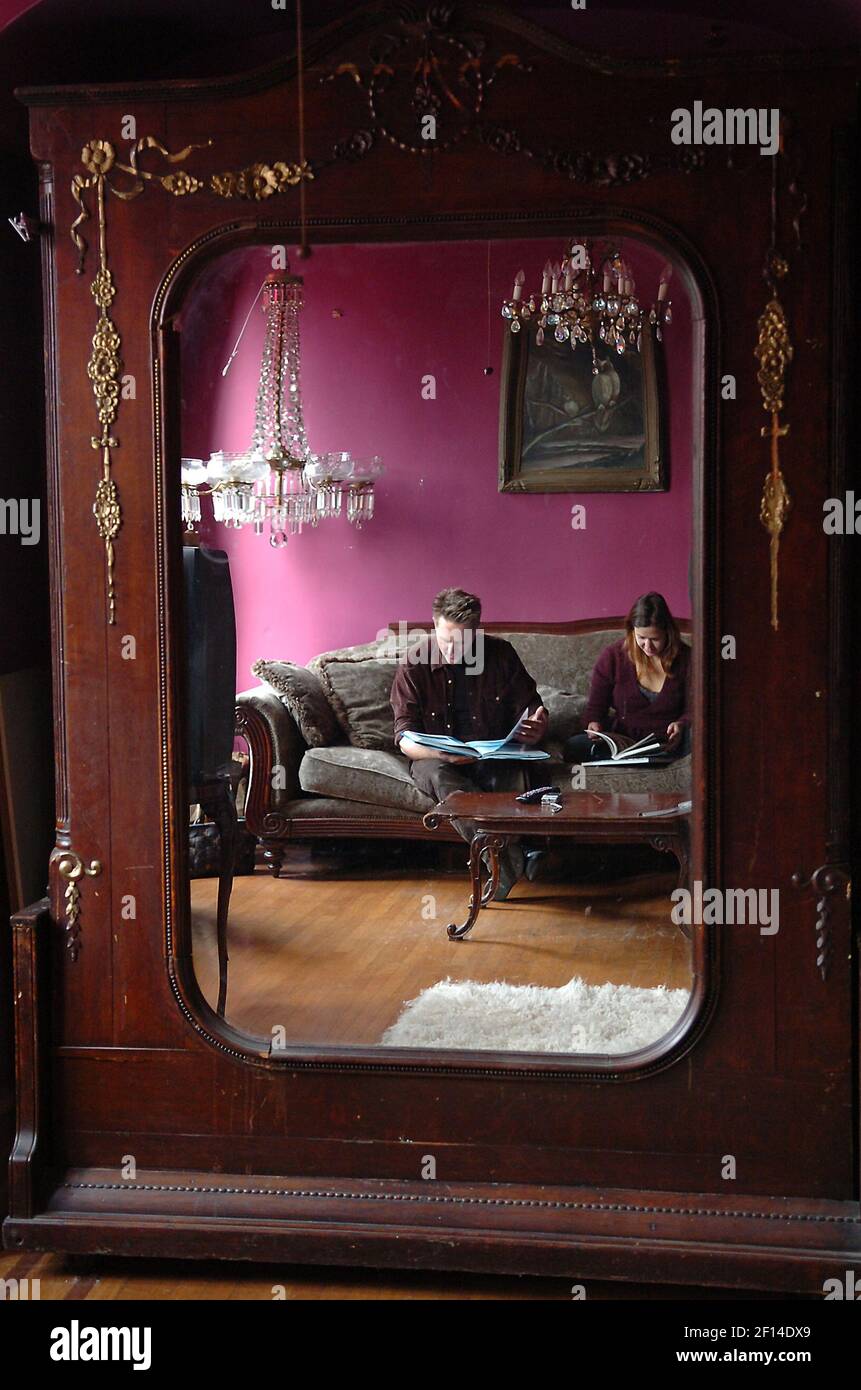 Adam Wallacavage and his girlfriend Jodi Rice are seen reflected from a ...