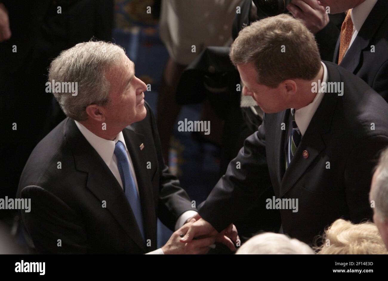 President George W. Bush talks with members of Congress as he departs ...
