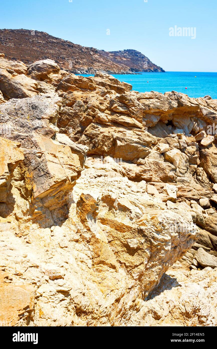 In greece the mykonos island rock sea and beach blue sky Stock Photo ...