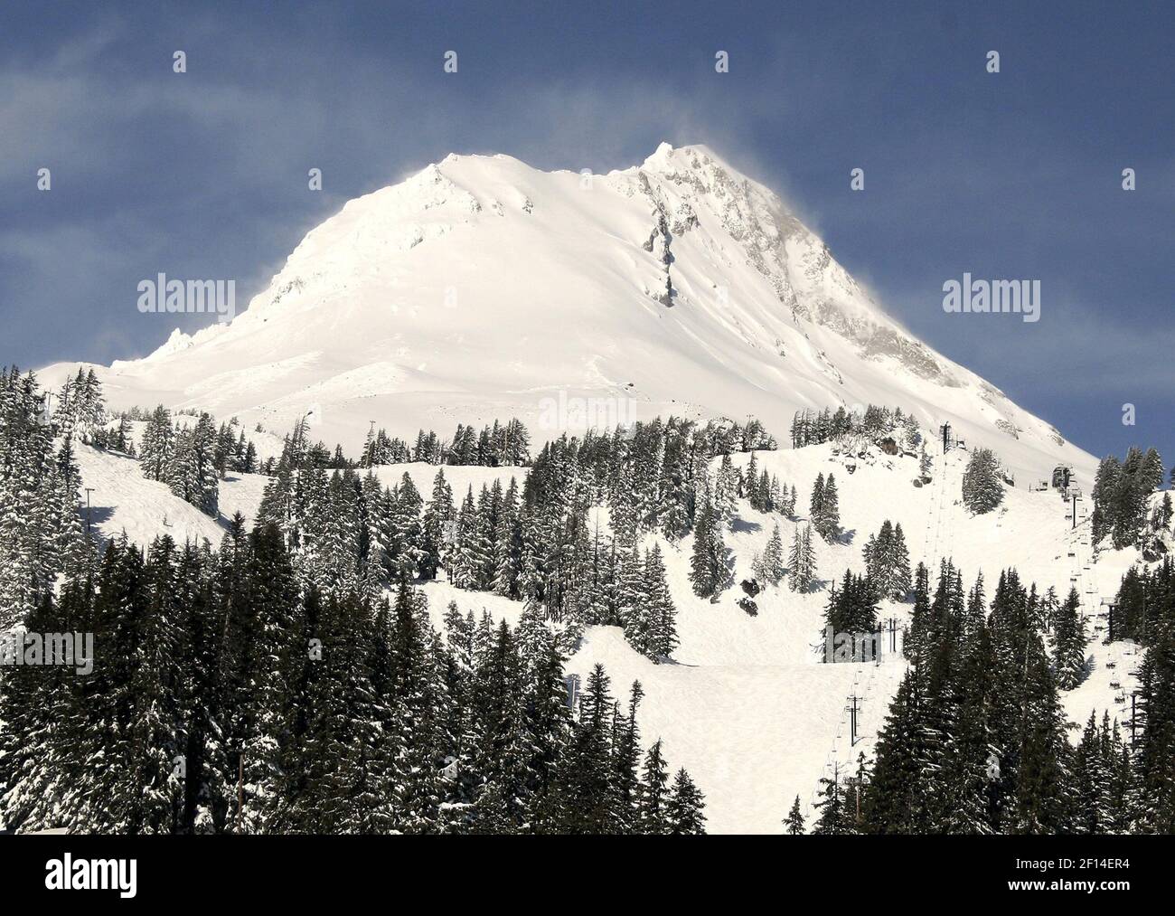 Plumes of wind-driven powder billow over Oregon's Mount Hood on a ...