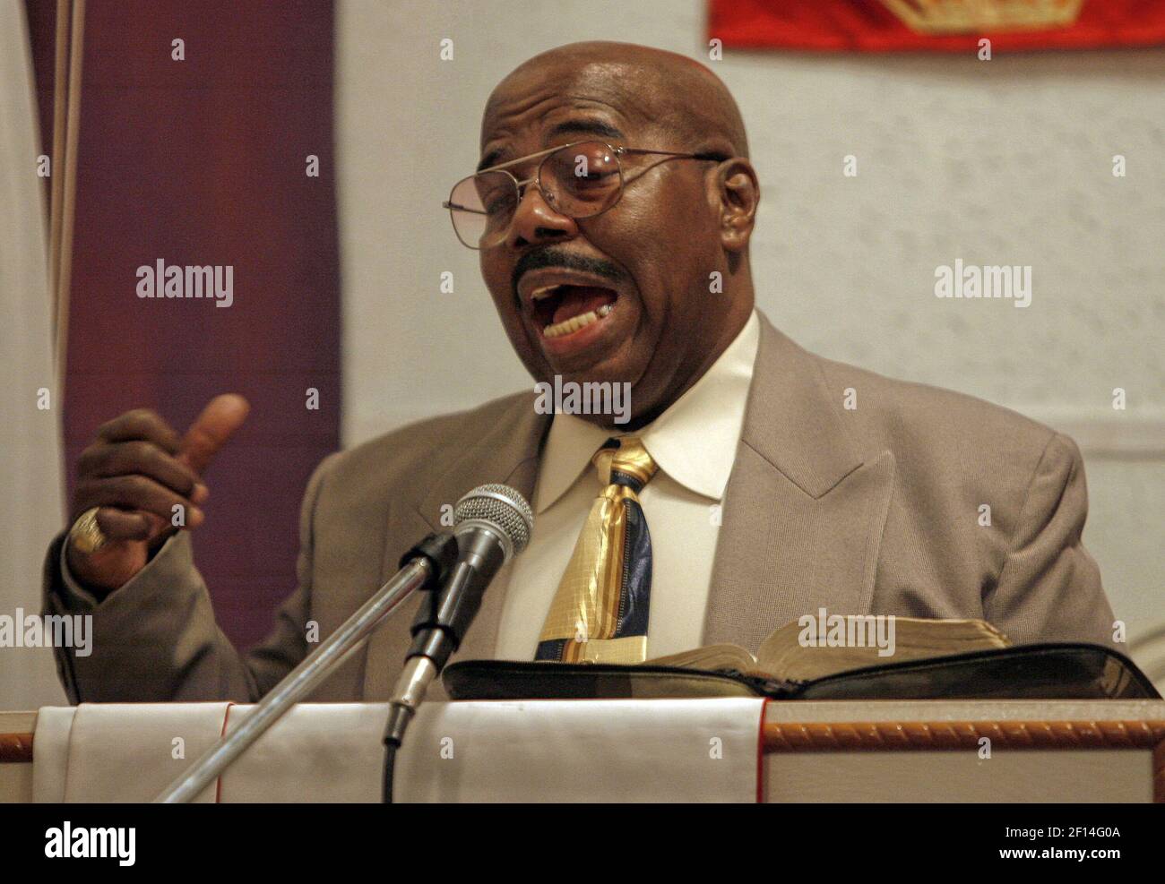 Pastor Garnet Mimms reads a passage from the Bible during Sunday school ...