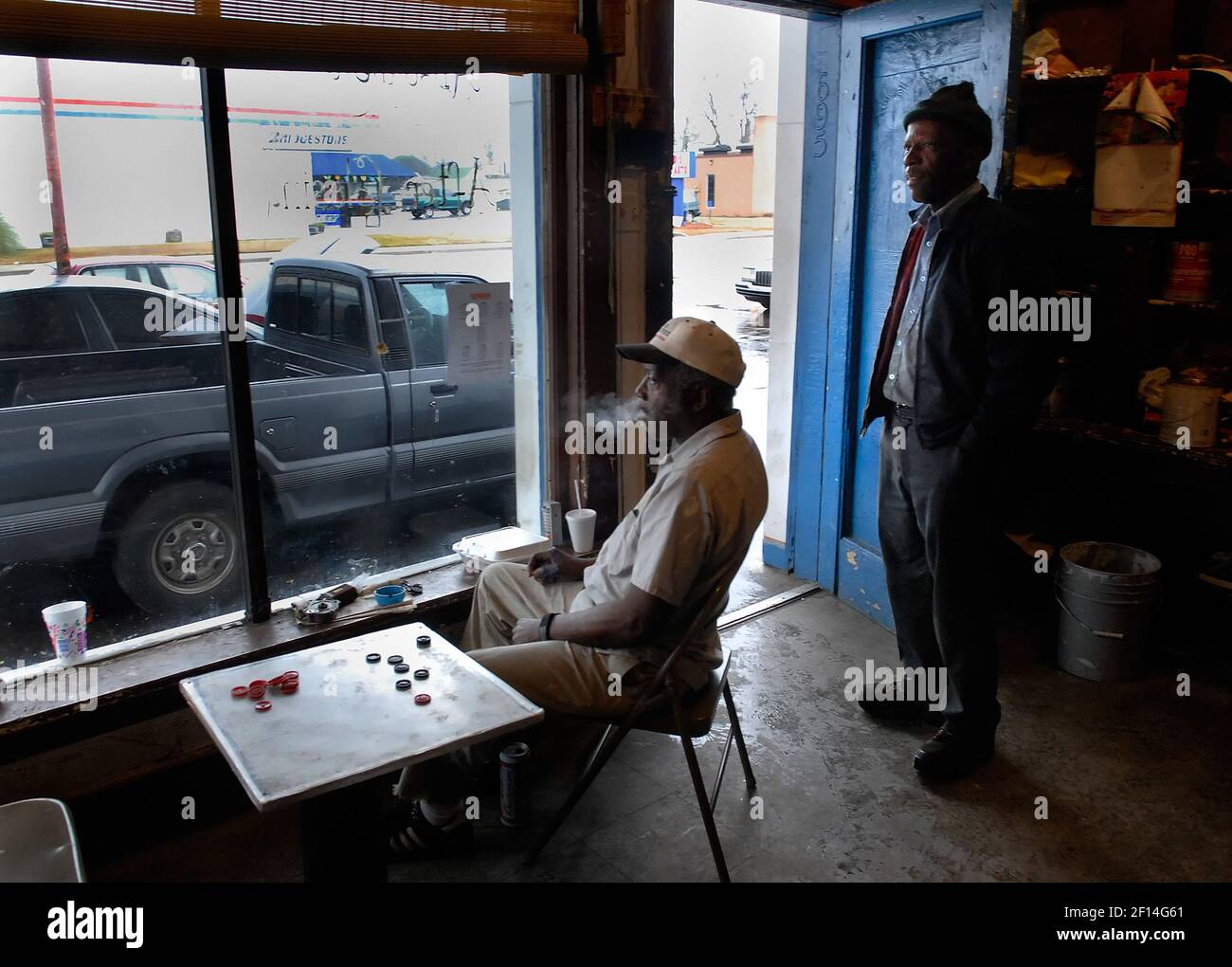 Ben Baker, owner of Baker's Garage, (standing, far right) supports U.S ...