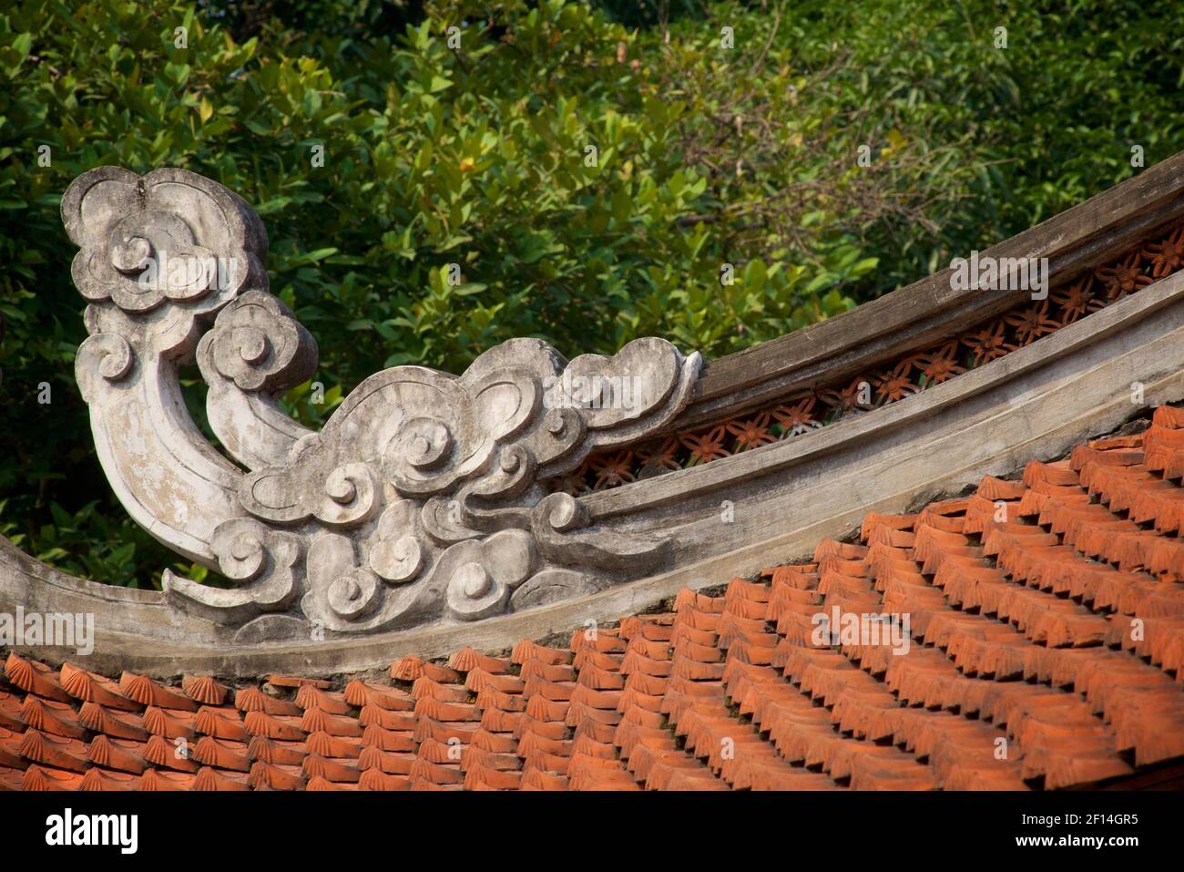 Roof architecture. Terracotta tiles on a building with upturned eaves ...