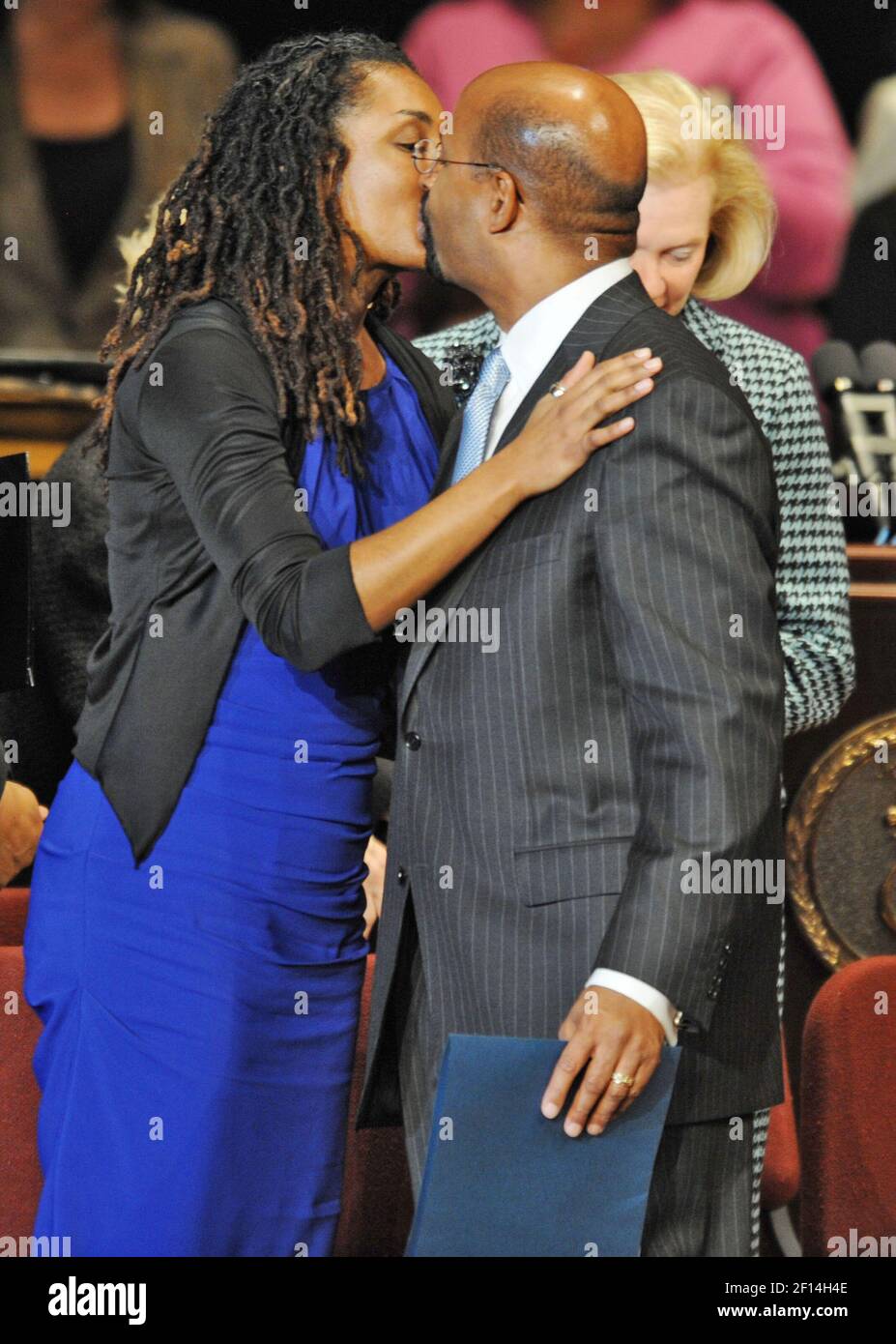 Mayor Michael Nutter, right, gets a congratulatory kiss from his wife ...