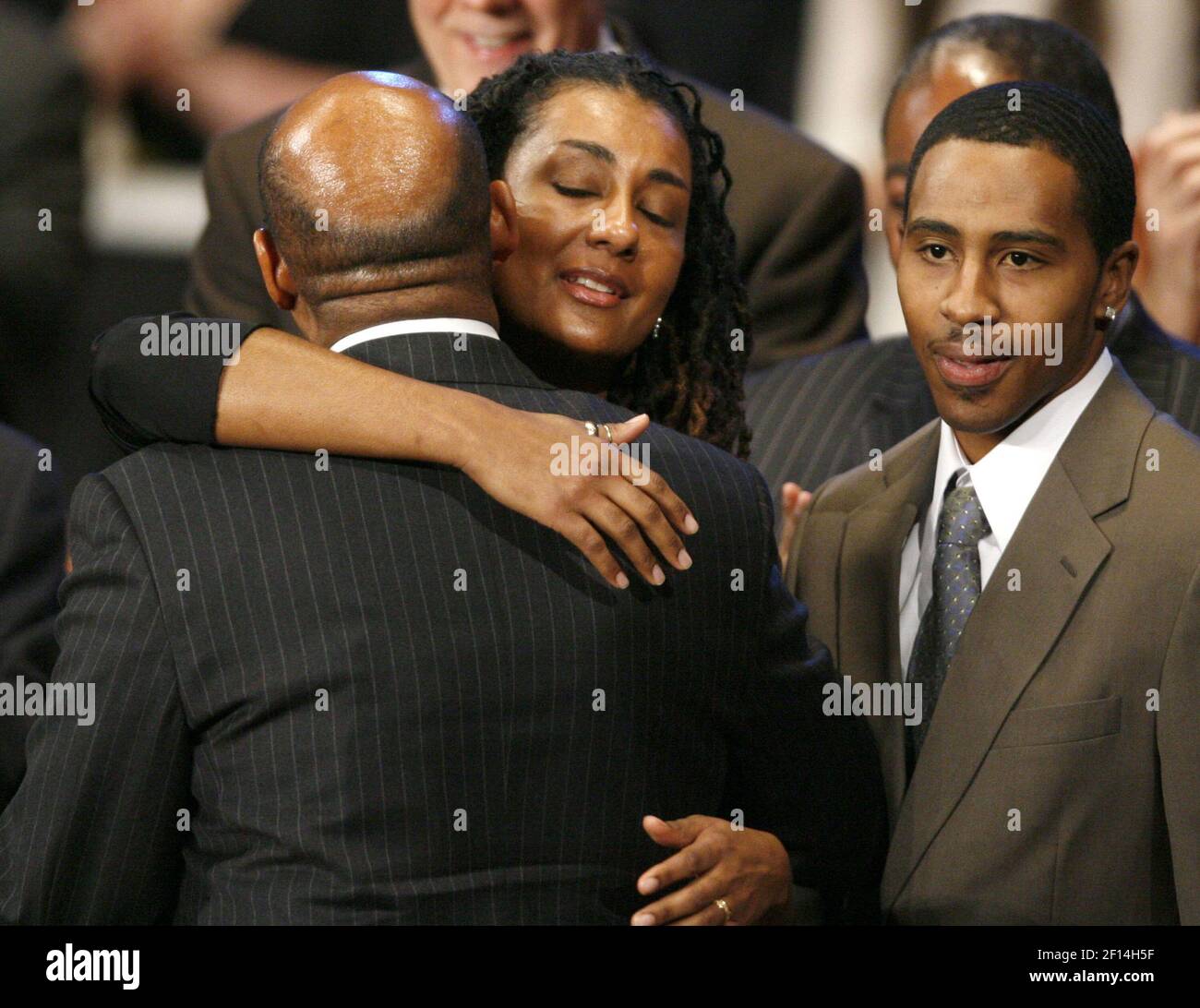 Philadelphia Mayor Michael Nutter, left, gets a congratulatory hug from ...