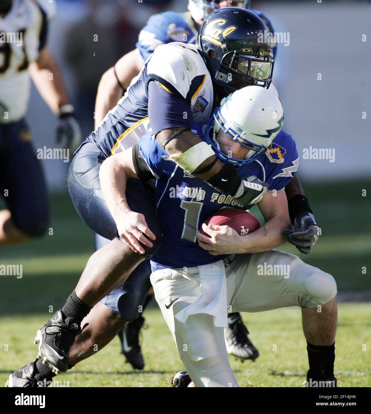 Worrell Williams of California (1) brings down Jim Ollis of Air Force ...