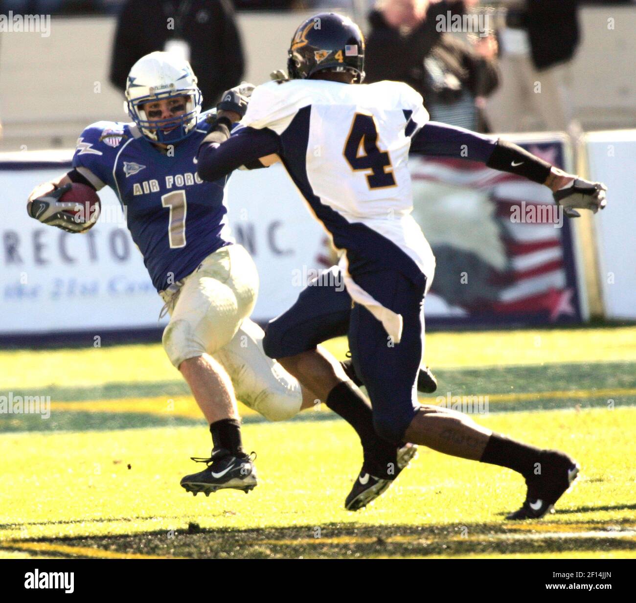 Chad Hall of Air Force (1) attempts to evade California safety Thomas ...