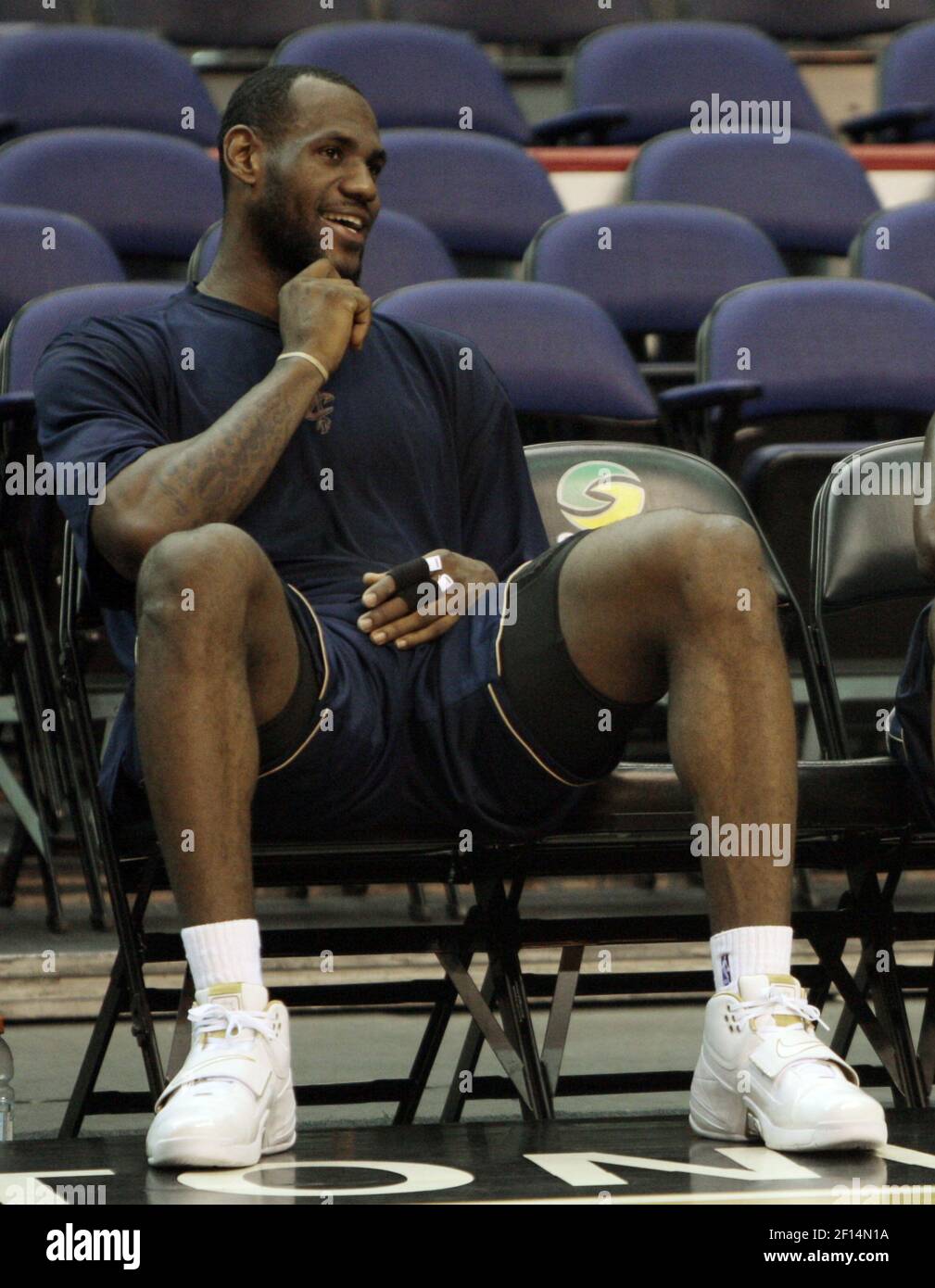 The Cleveland Cavaliers' LeBron James sits on the sidelines with his ...