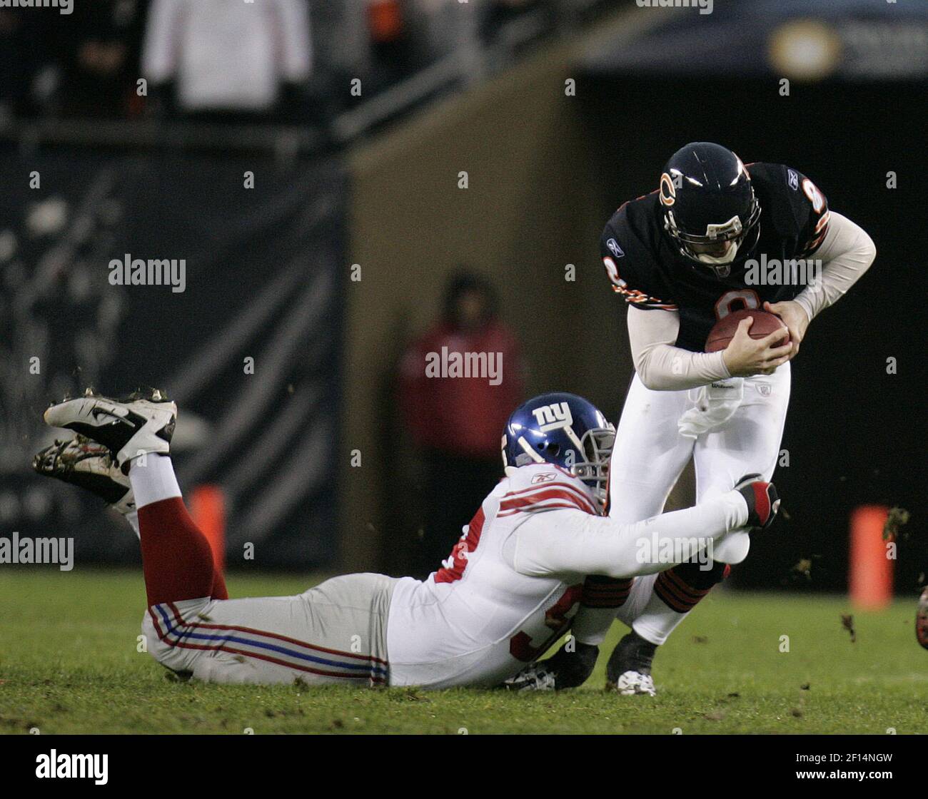 New York Giants Fred Robbins sacks Chicago Bears quarterback Rex ...